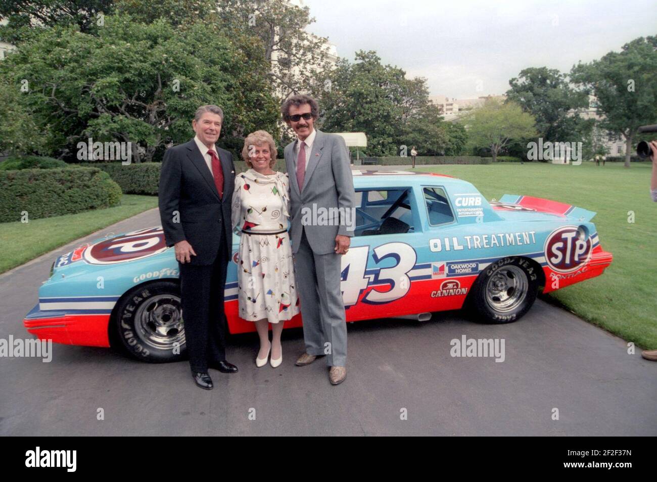 President Ronald Reagan posing with race car driver Richard Petty and ...