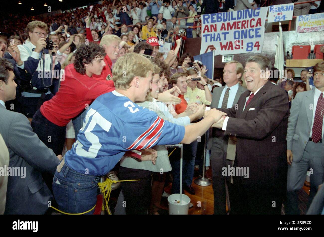 President Ronald Reagan shaking hands with unidentified members of the ...
