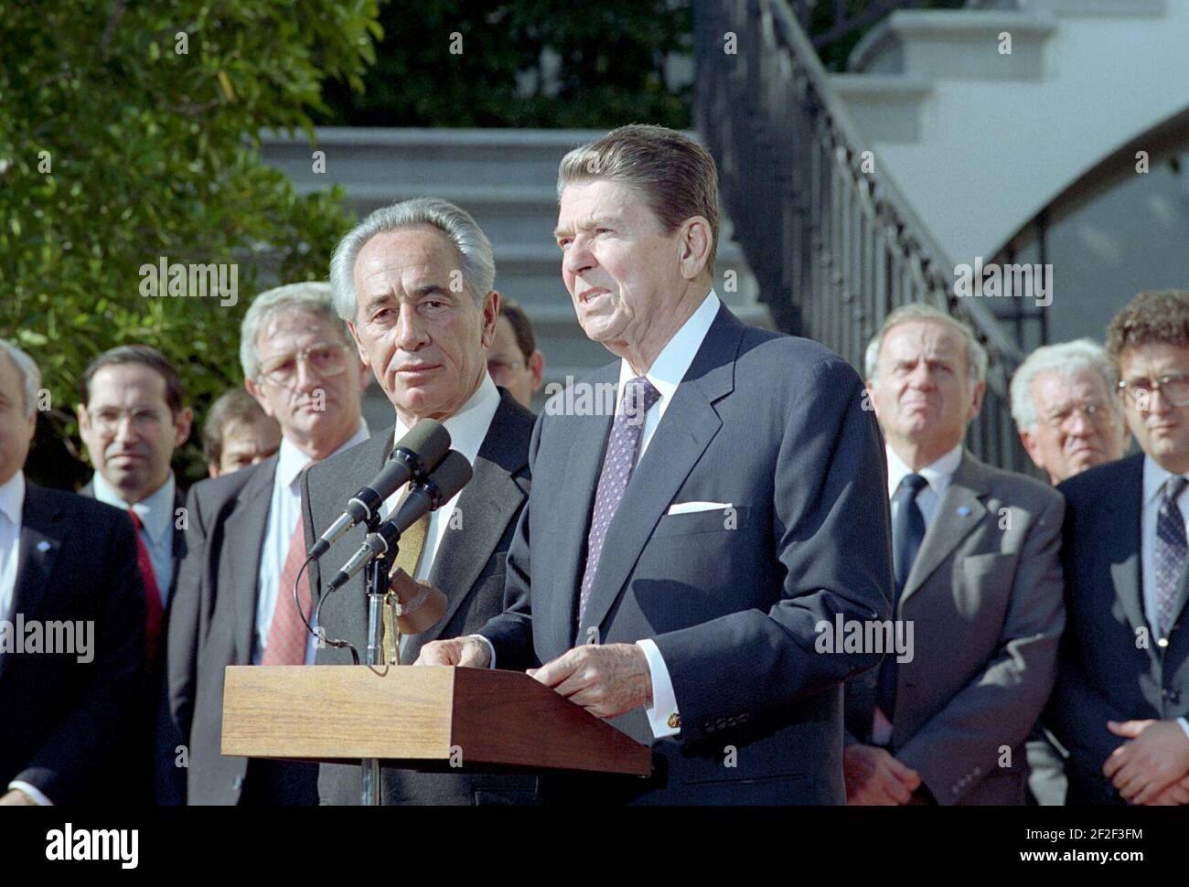 President Ronald Reagan speaking at a podium during a working visit of ...