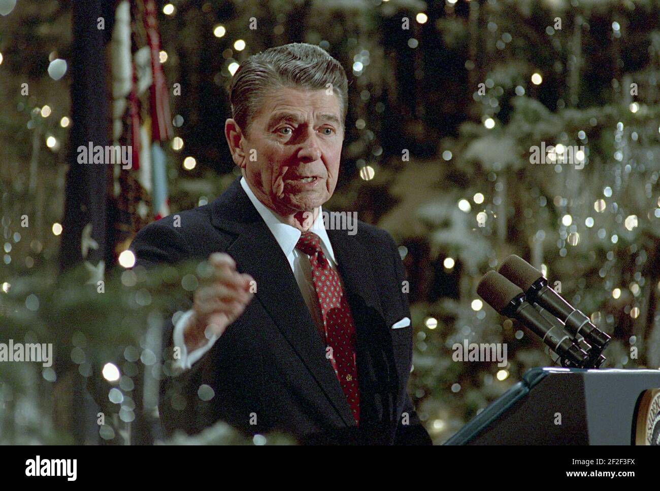 President Ronald Reagan speaking at a podium during his final press ...