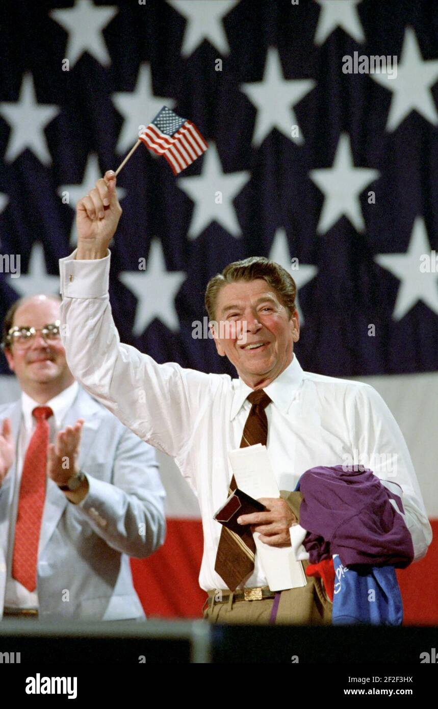 President Ronald Reagan waving an American flag in Atlanta Stock Photo ...