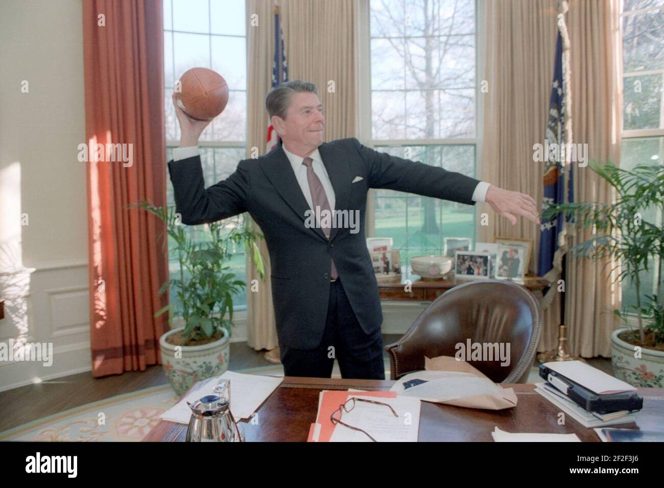 President Ronald Reagan throwing a football in the Oval Office Stock ...
