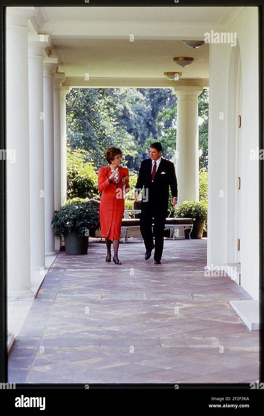President Ronald Reagan walking and talking with Republican Senator ...