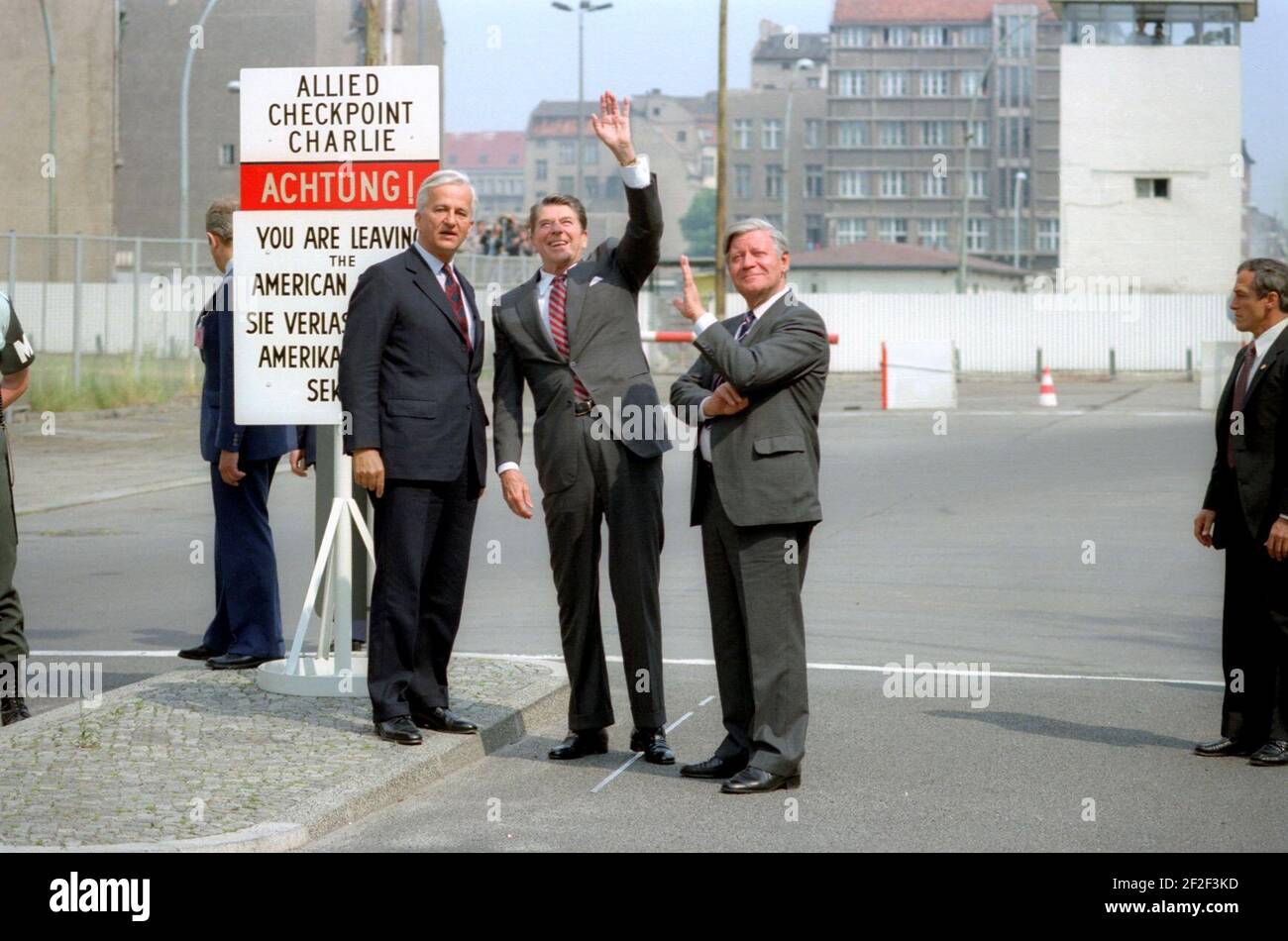 President Ronald Reagan waves and stands with Chancellor Helmut Schmidt ...