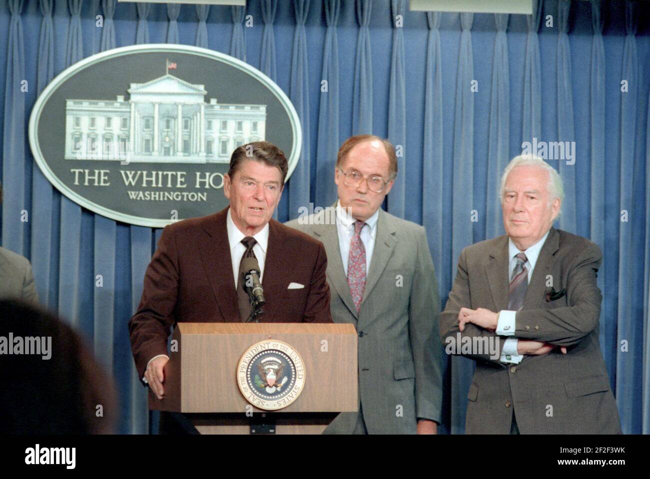 President Ronald Reagan with William Rehnquist and Warren Burger Stock ...
