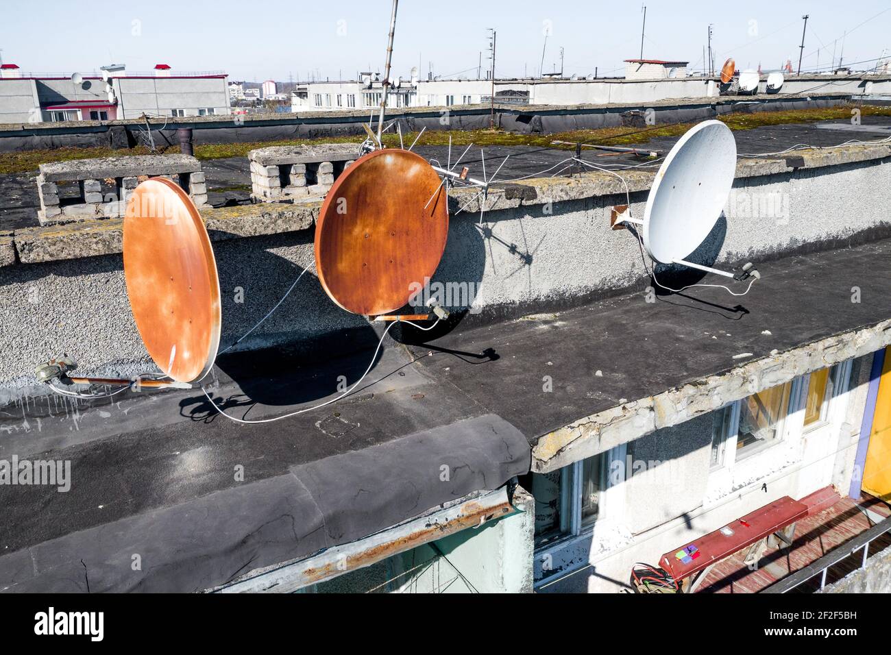 Satellite dishes on house roof hi-res stock photography and images - Alamy