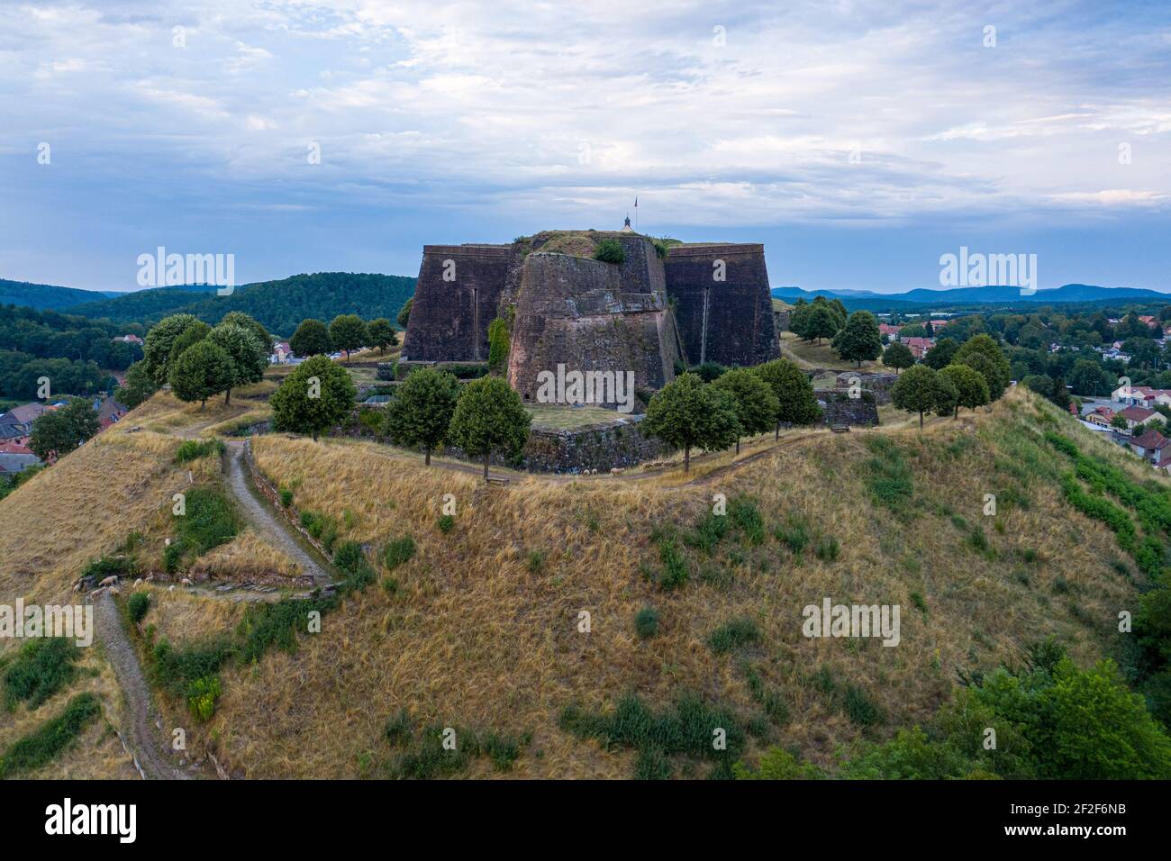 Close-up of defense stone wall of Citadel of Bitche. Pathway leading ...