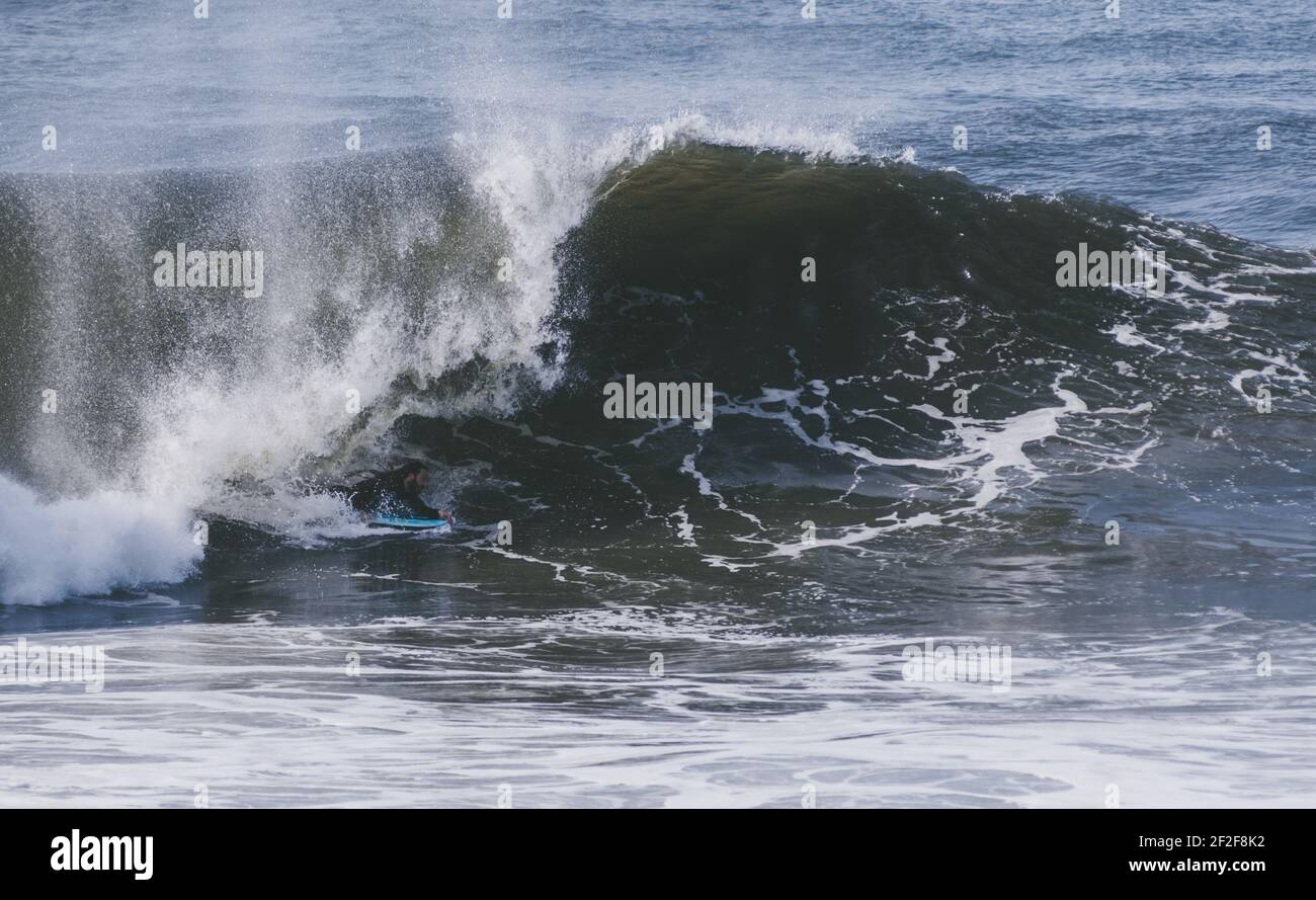 NAZARé, PORTUGAL - Feb 02, 2021: An amazing shot of big waves crashing ...