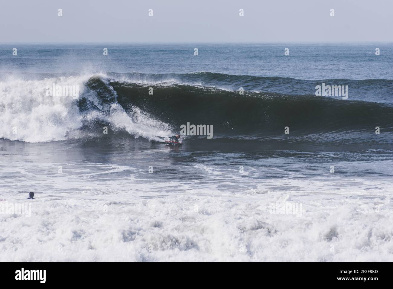NAZARé, PORTUGAL - Feb 02, 2021: An amazing shot of big waves crashing ...