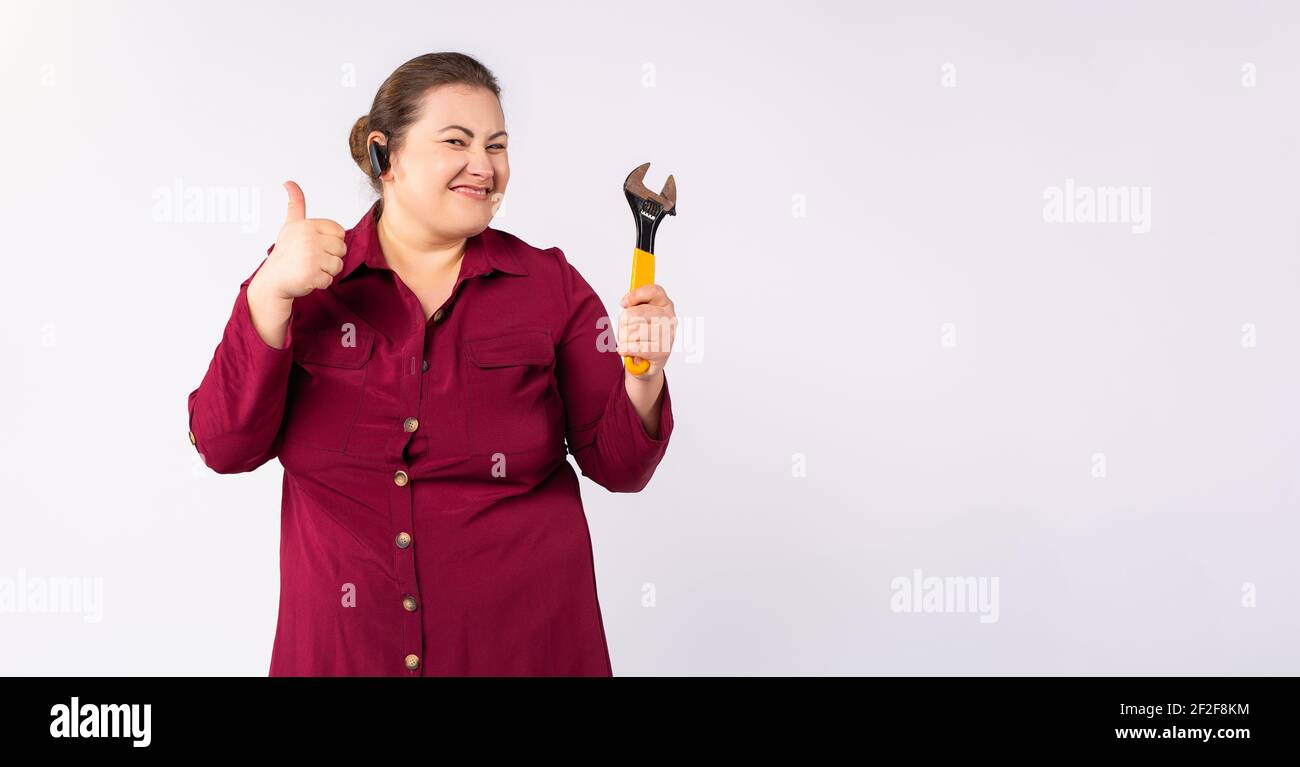 Banner, long format, grey background Female fat mechanic or a plumber ...