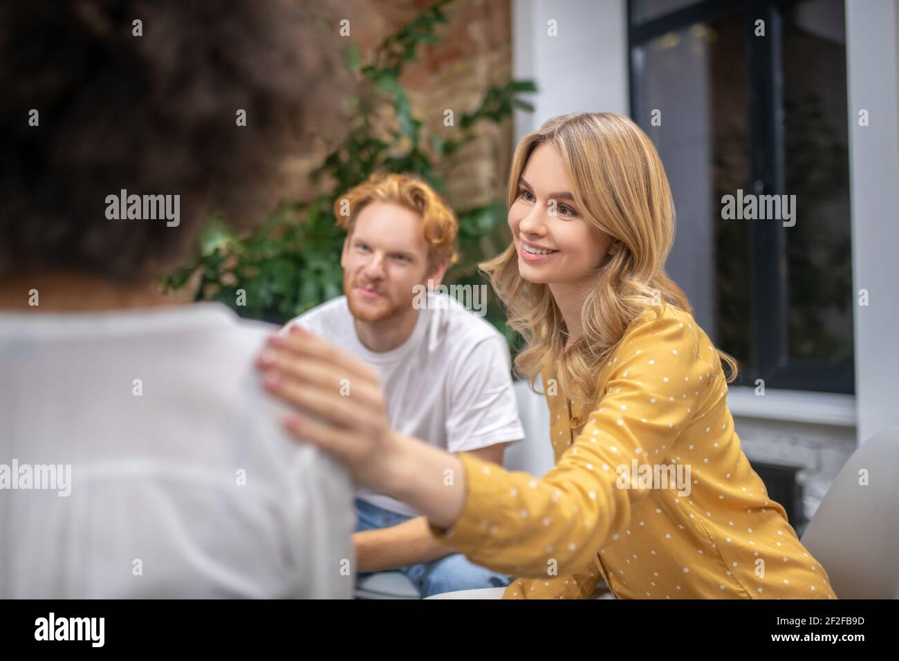 Group members supporting each other and looking friendly Stock Photo ...