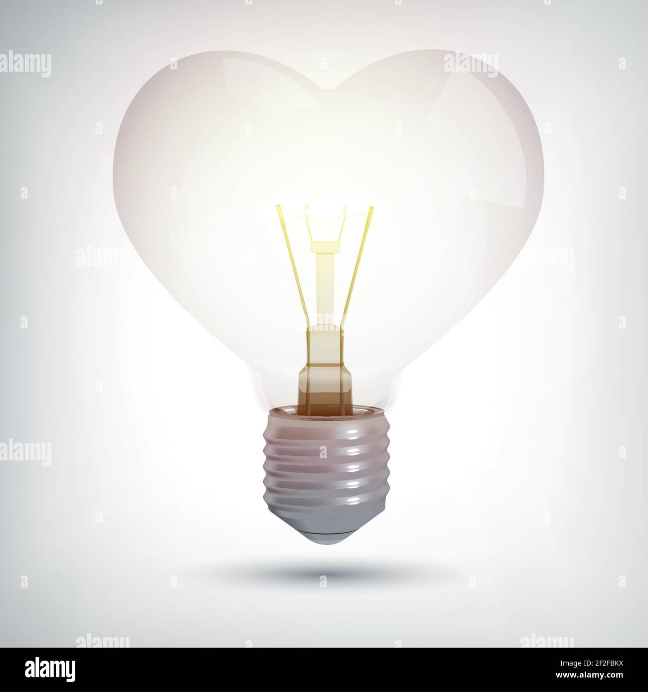 Realistic illuminated electric bulb concept in heart shape as symbol of ...