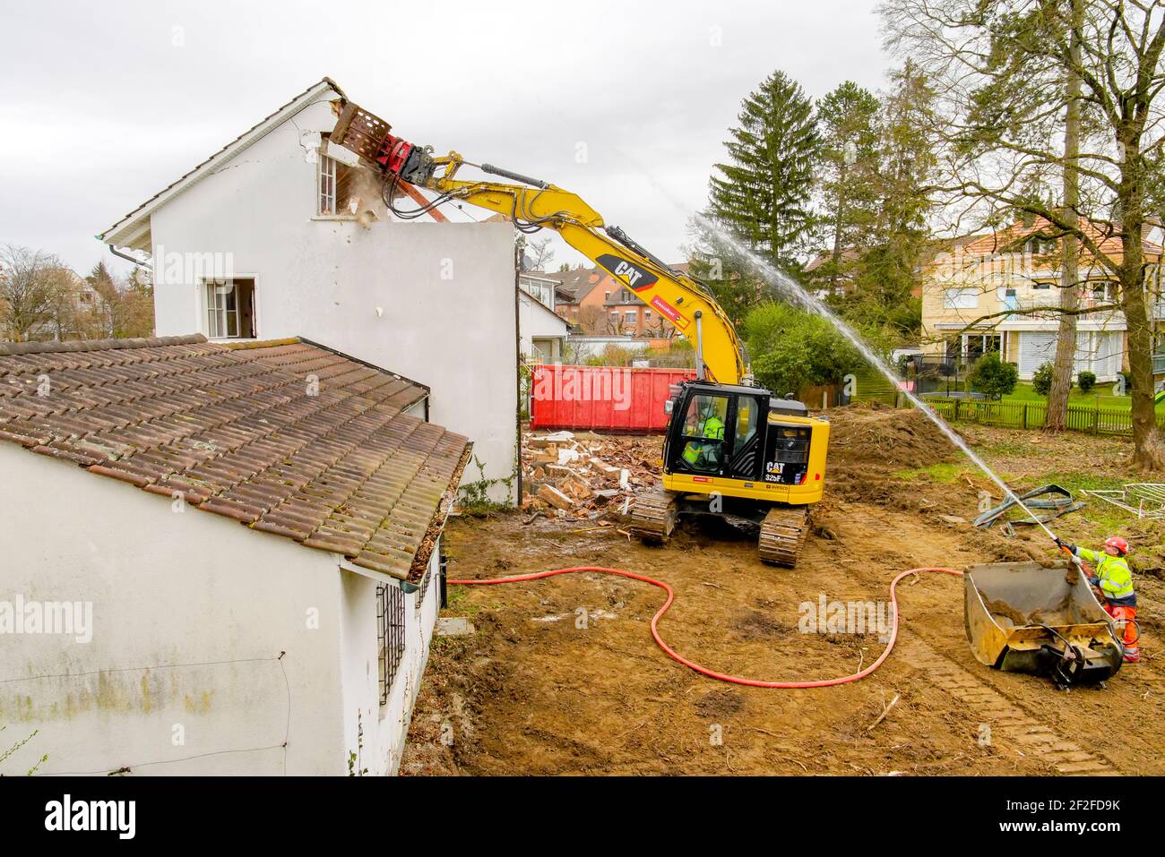 Heavy bulldozer tearing down a villa and frees up space for a new ...