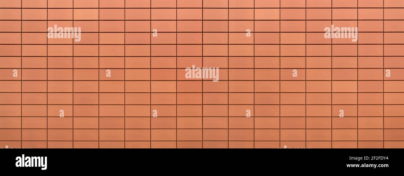 Rectangular orange tile panels on a wall Stock Photo - Alamy