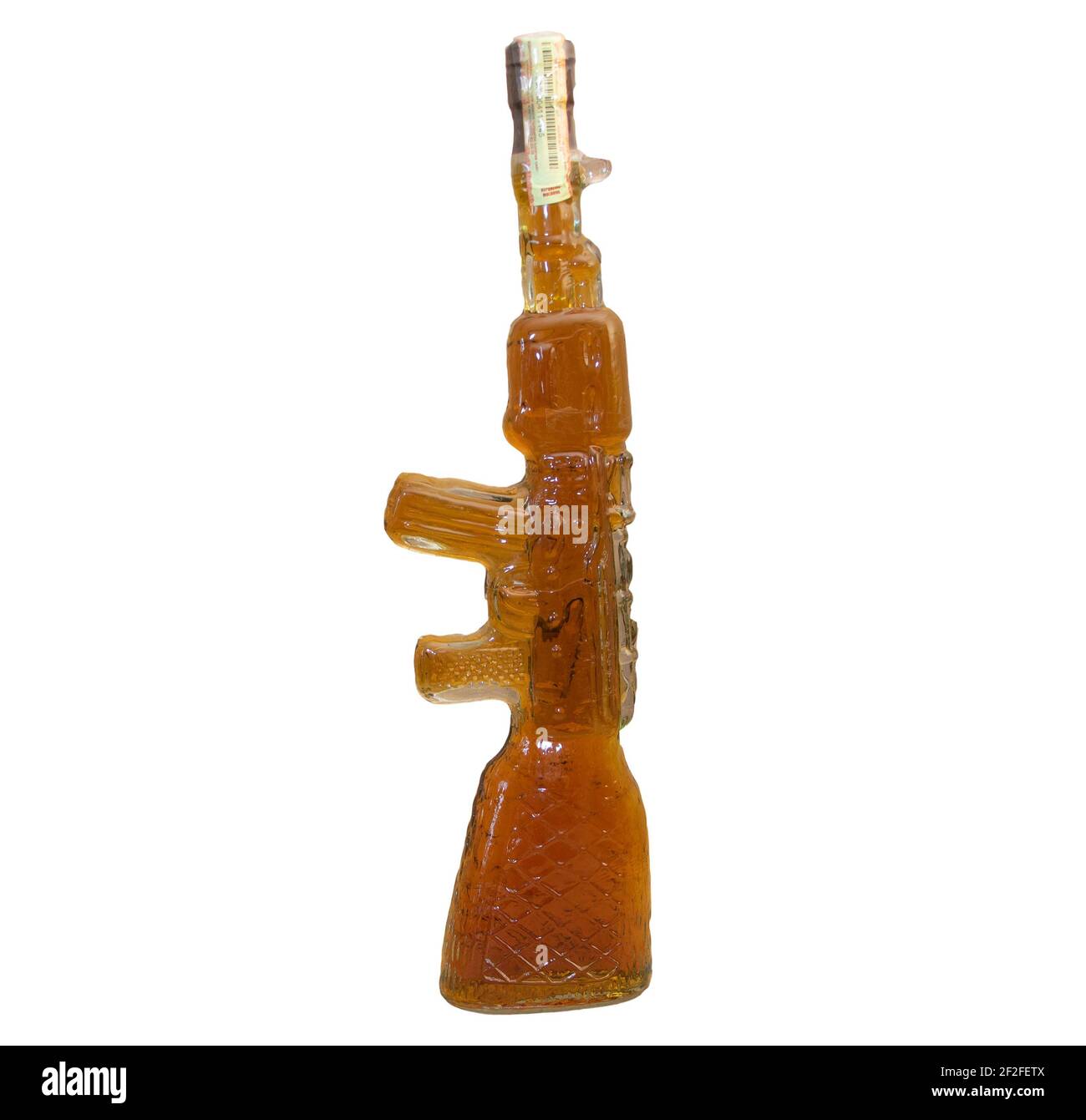 A bottle of alcohol in the form of AK-47 weapon isolated on white ...
