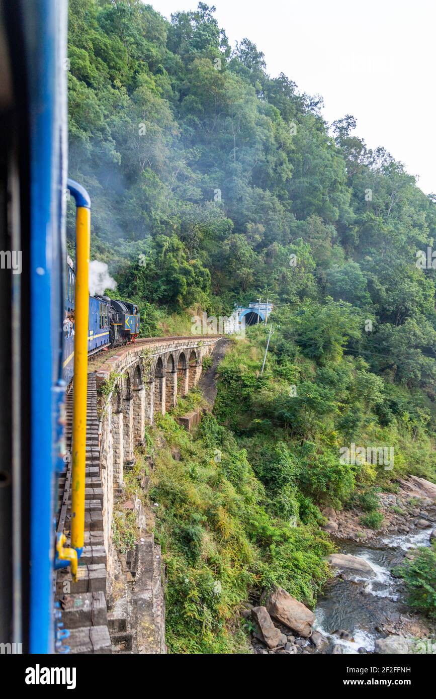Blue Mountain Train drives over a bridge, Tamil Nadu, India Stock Photo ...