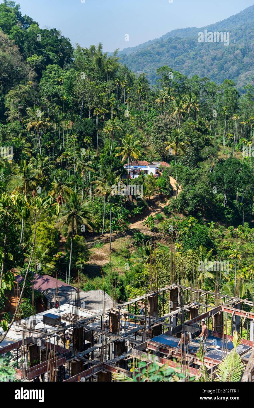 Workers on a construction site in the middle of the forest, Munnar ...