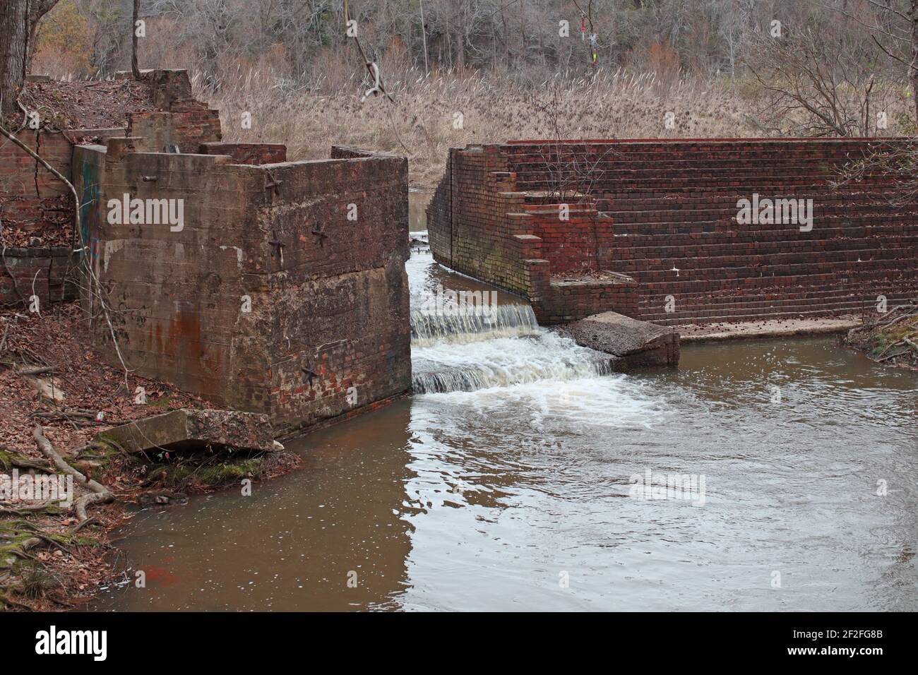A man made brick brick river dam made of brick in rural Georgia nature ...