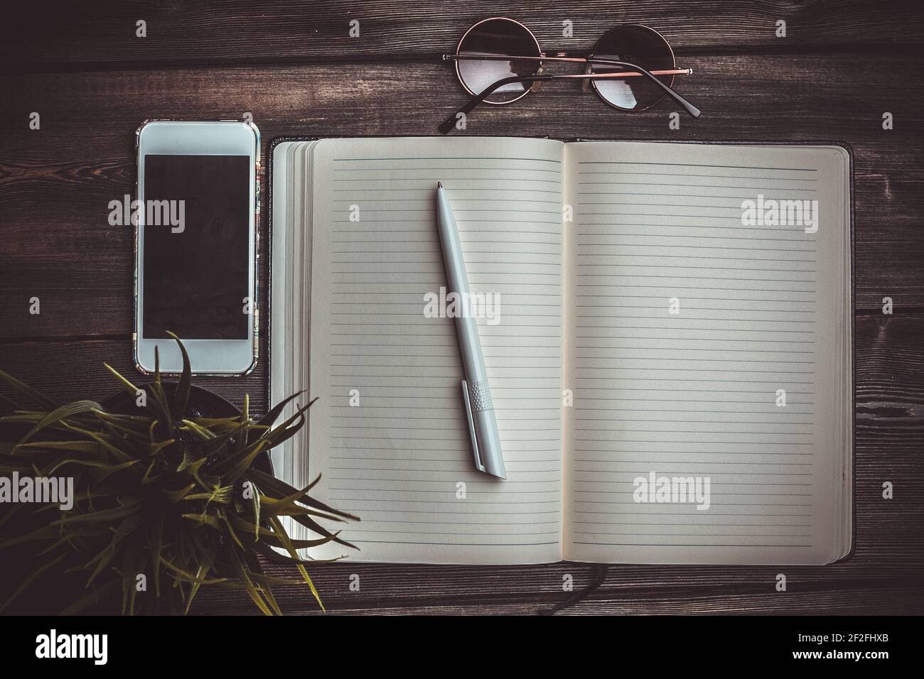 work desk notepad with pen drink cup phone technology Stock Photo - Alamy