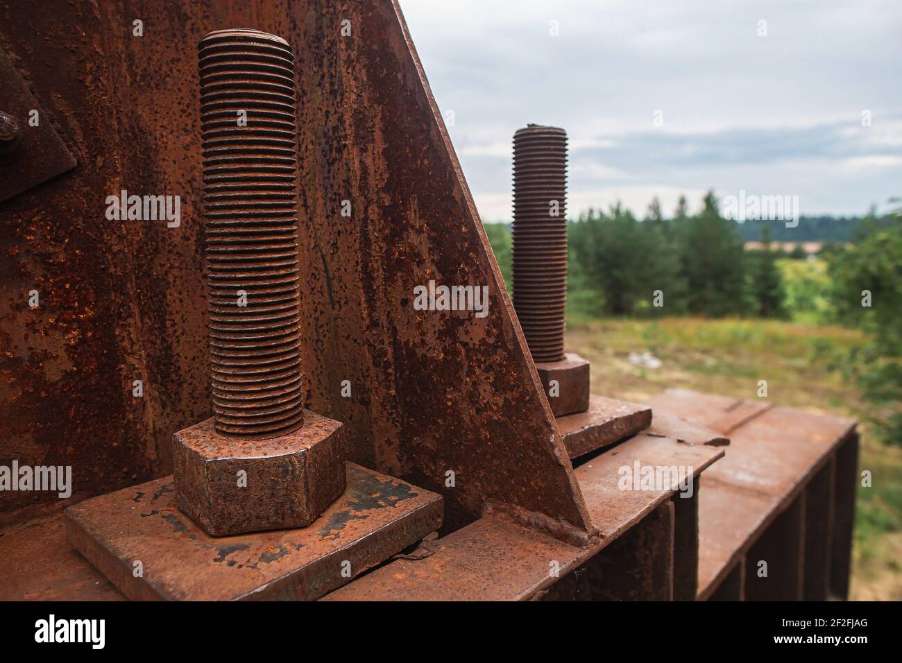 Large rusty bolts on a high-voltage power line tower Stock Photo - Alamy