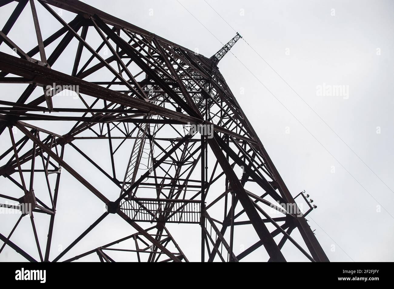 High-voltage power line tower view from below Stock Photo - Alamy