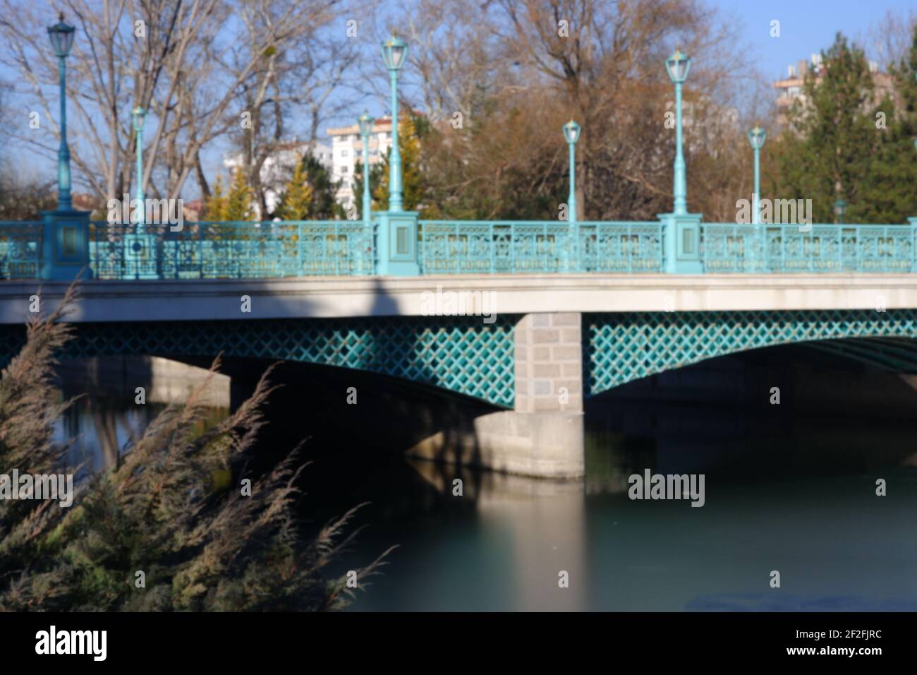 Green Bridge over frozen river Stock Photo - Alamy