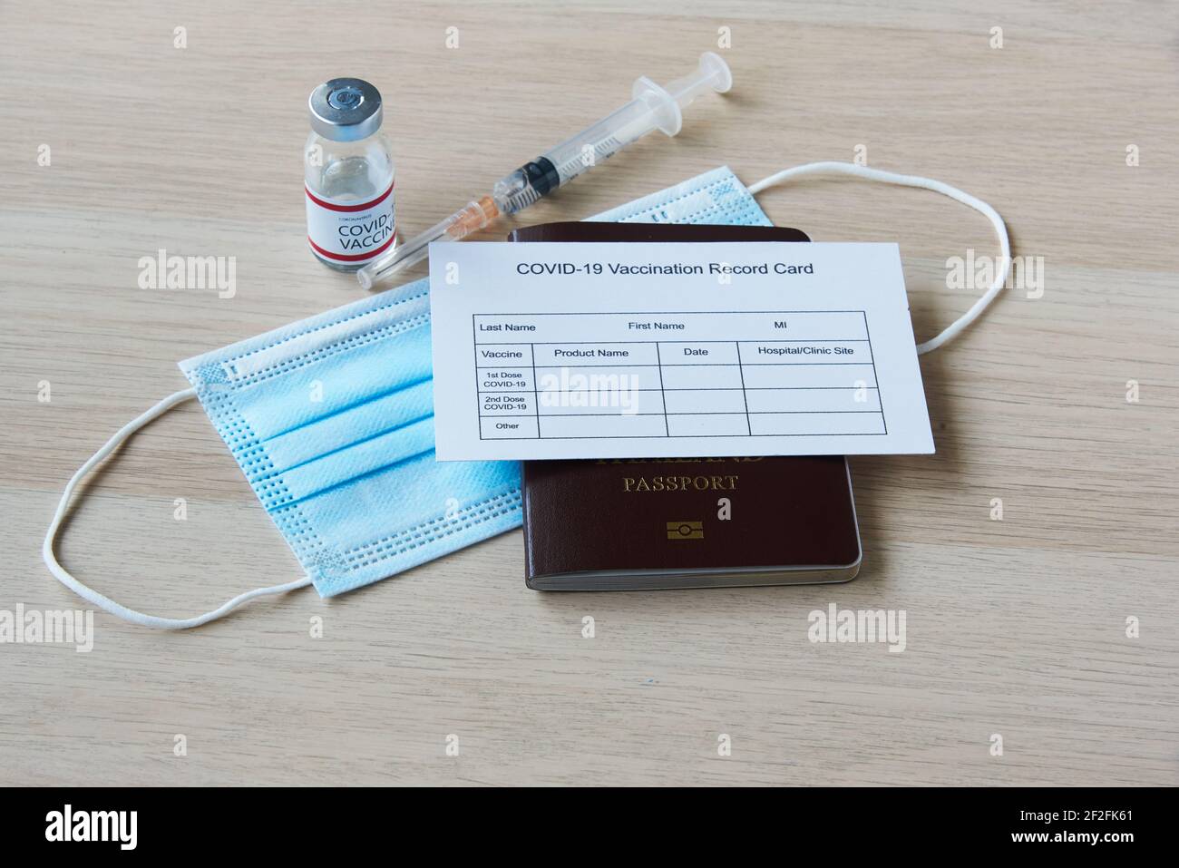 Travel in new normal. Passport, immunization record form, face mask ...