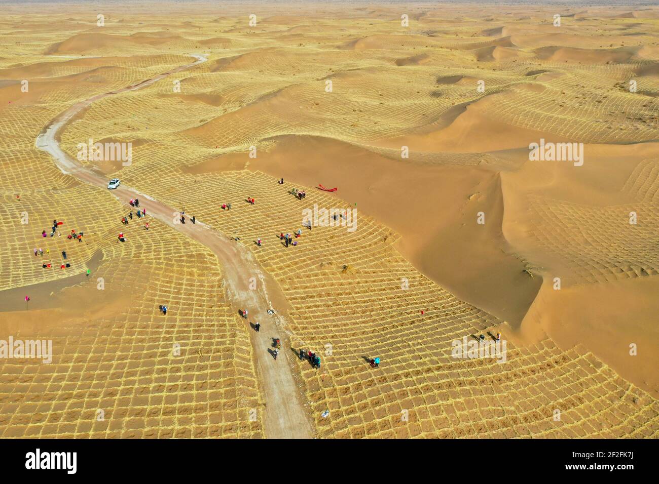 Linze, China. 12th Mar, 2021. LINZE, CHINA - MARCH 12, 2021 - Residents ...