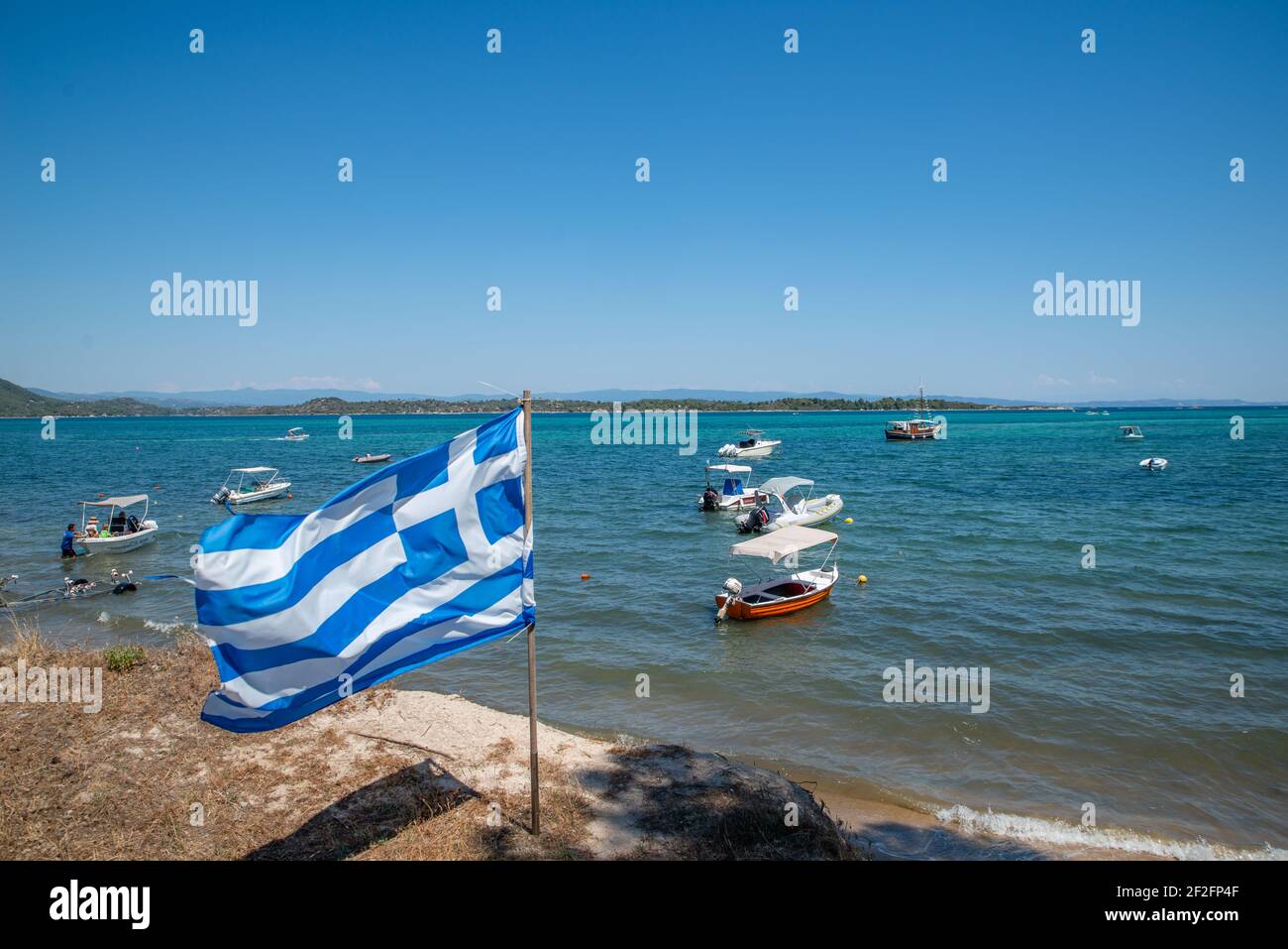 Greek flag by the sea Stock Photo - Alamy