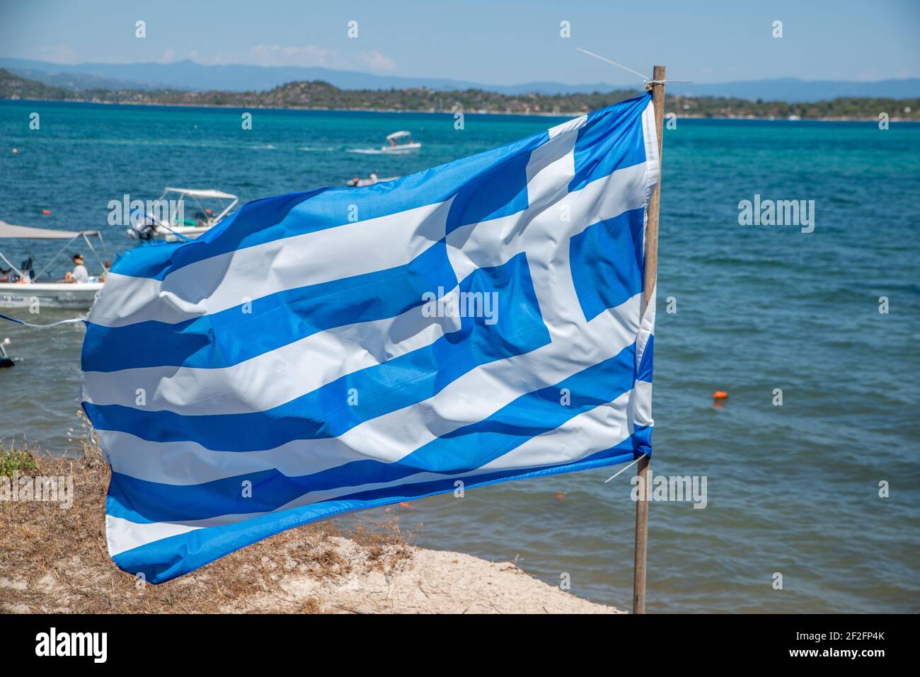 Greek flag by the sea Stock Photo - Alamy