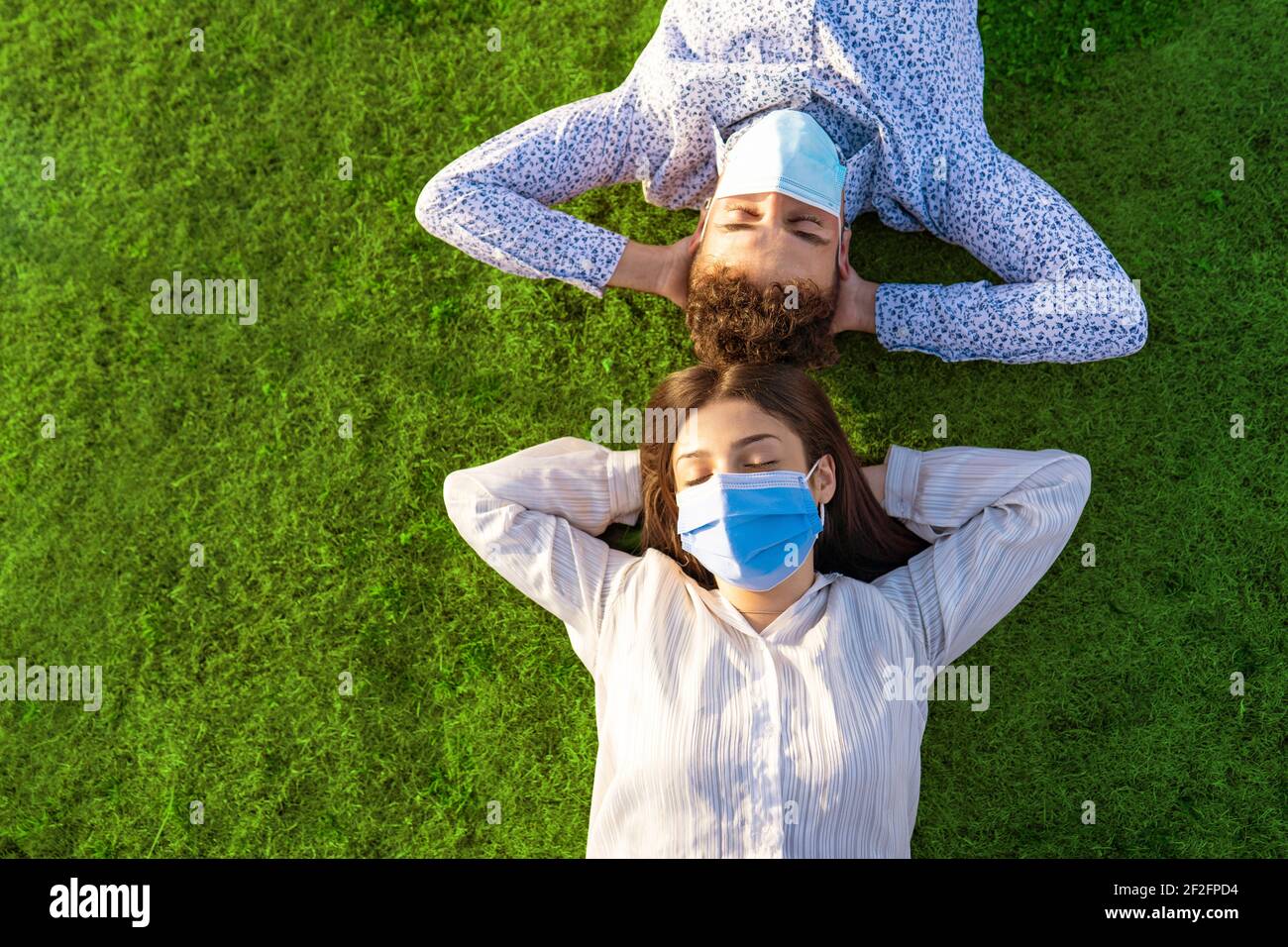 Happy couple despite social distancing due to Coronavirus pandemic. Top ...