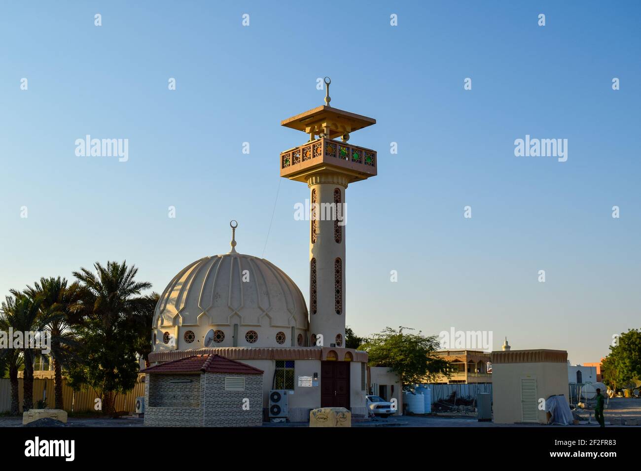 A small old mosque surrounded by date palm trees Stock Photo - Alamy