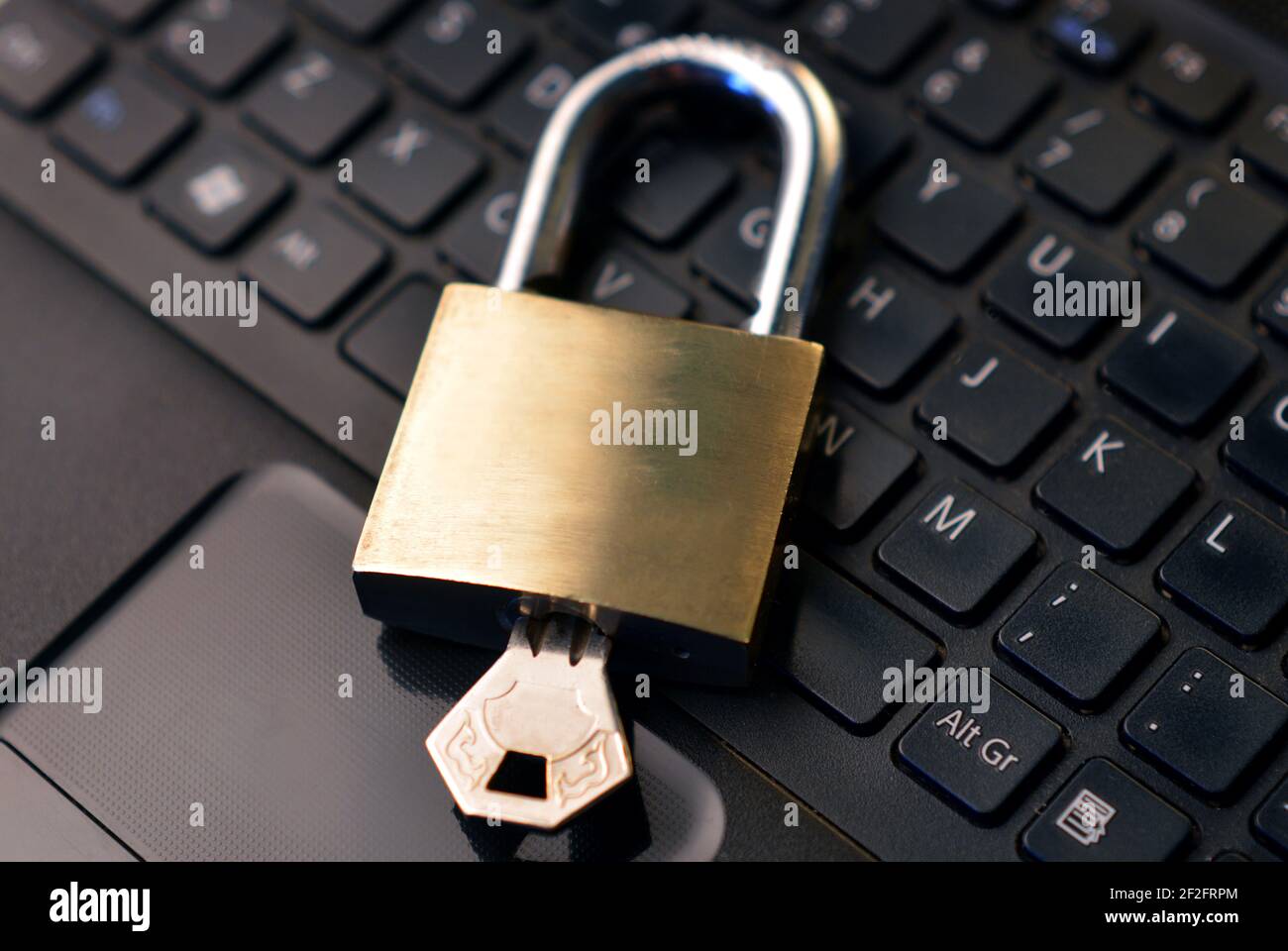Detail of a metallic security padlock above a computer keyboard Stock ...