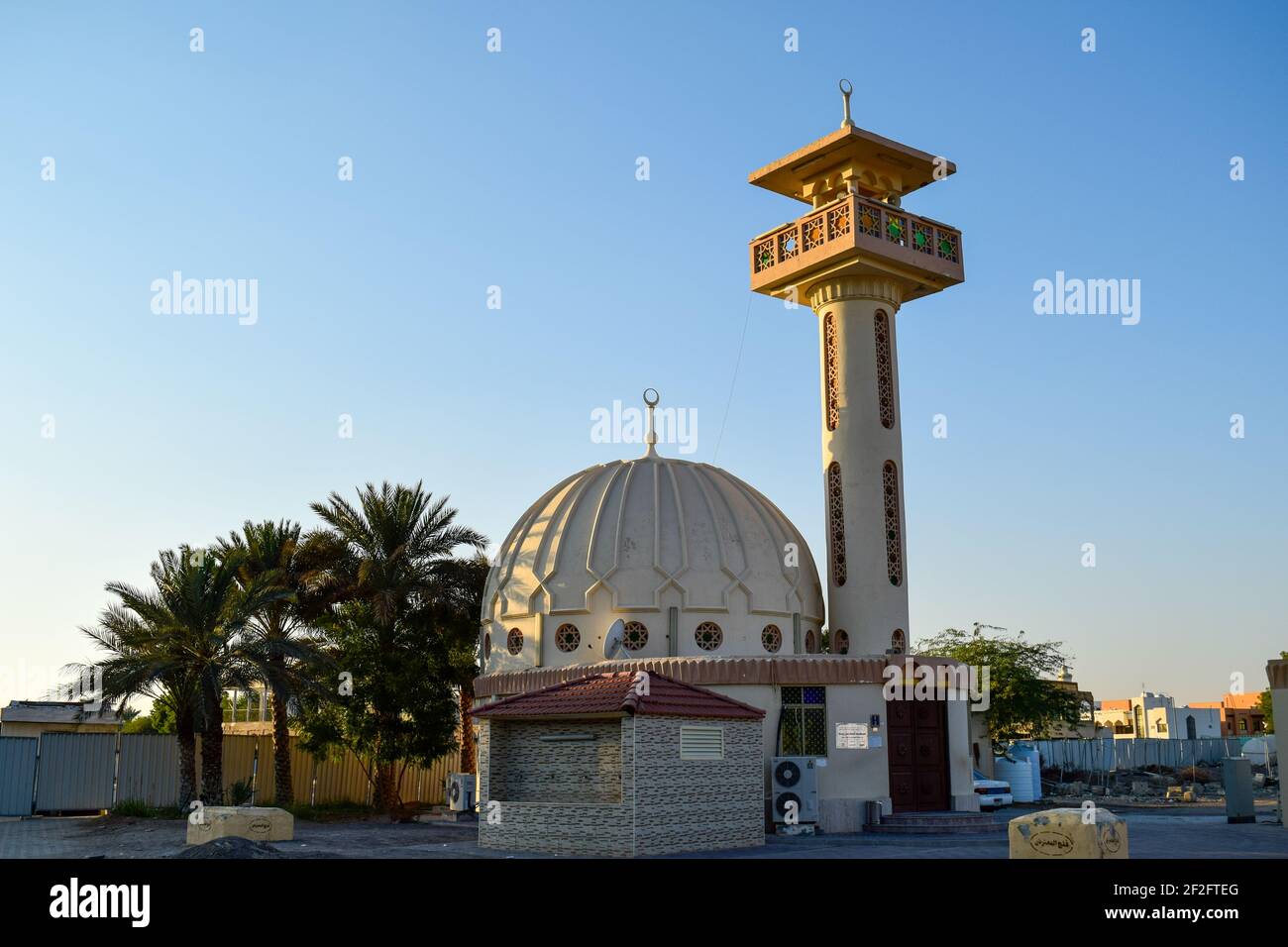 A small old mosque surrounded by date palm trees Stock Photo - Alamy
