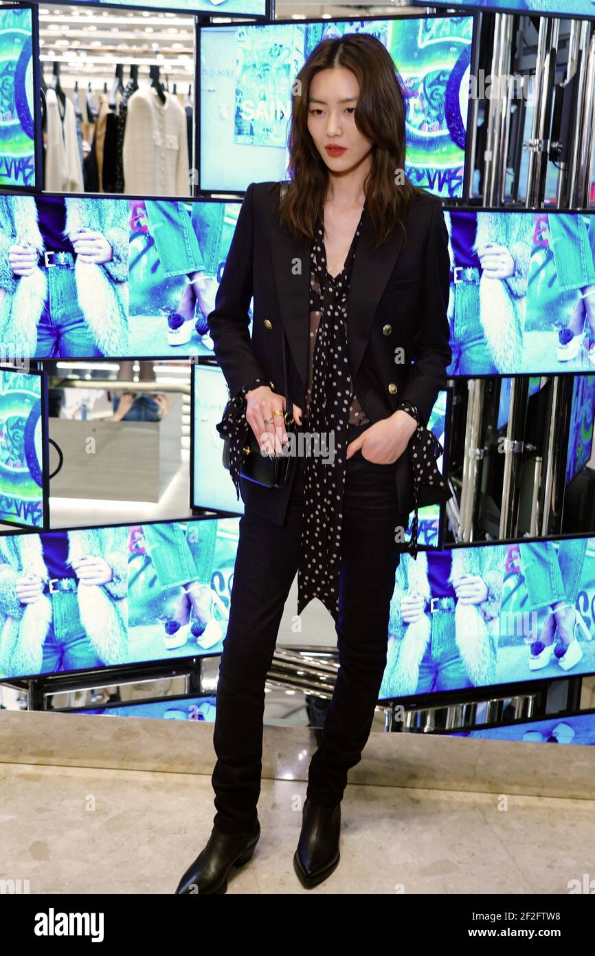 Chinese model Liu Wen stands for a promotional event of luxury brand ...