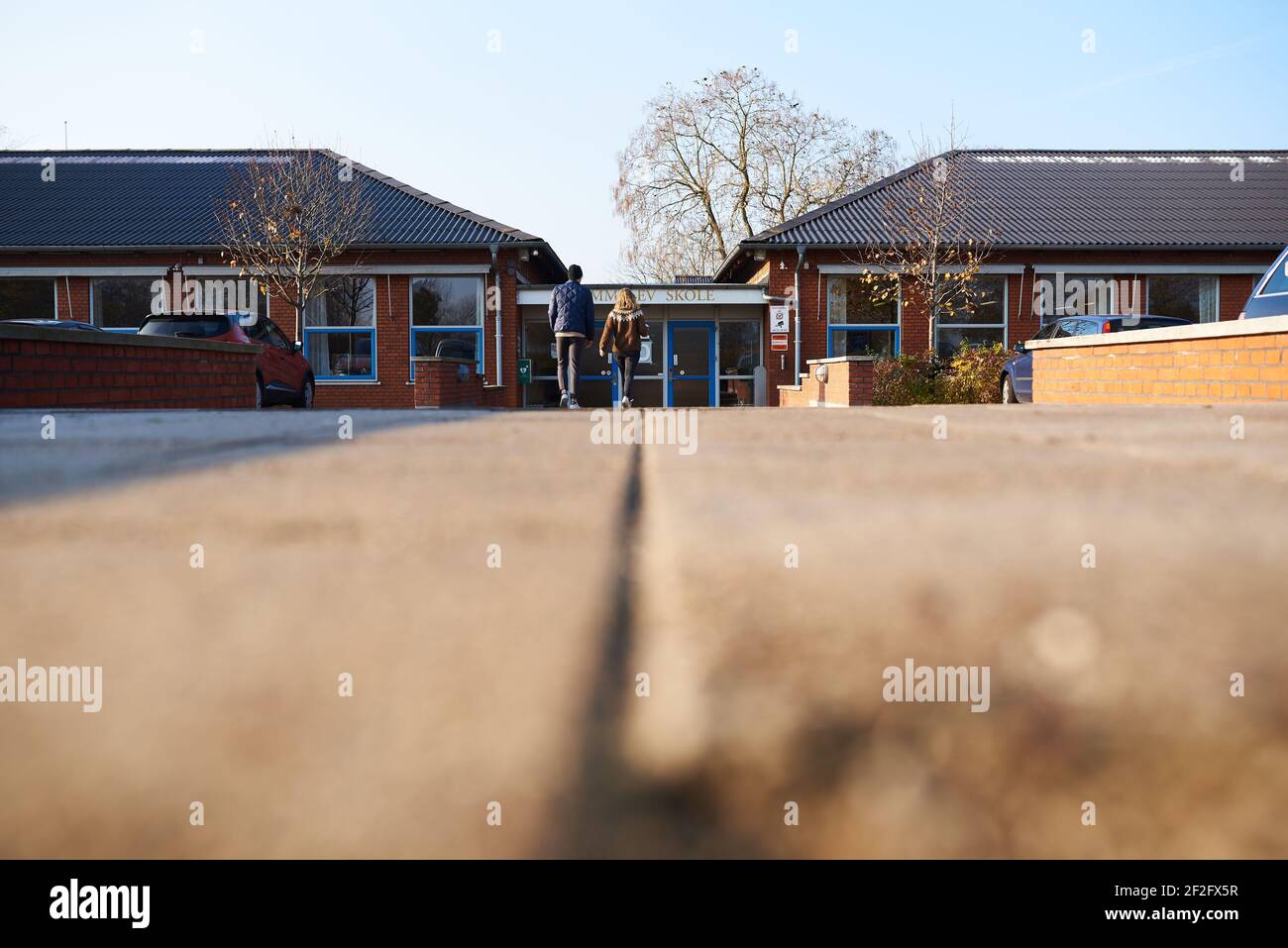 Two student walking together to school Stock Photo - Alamy