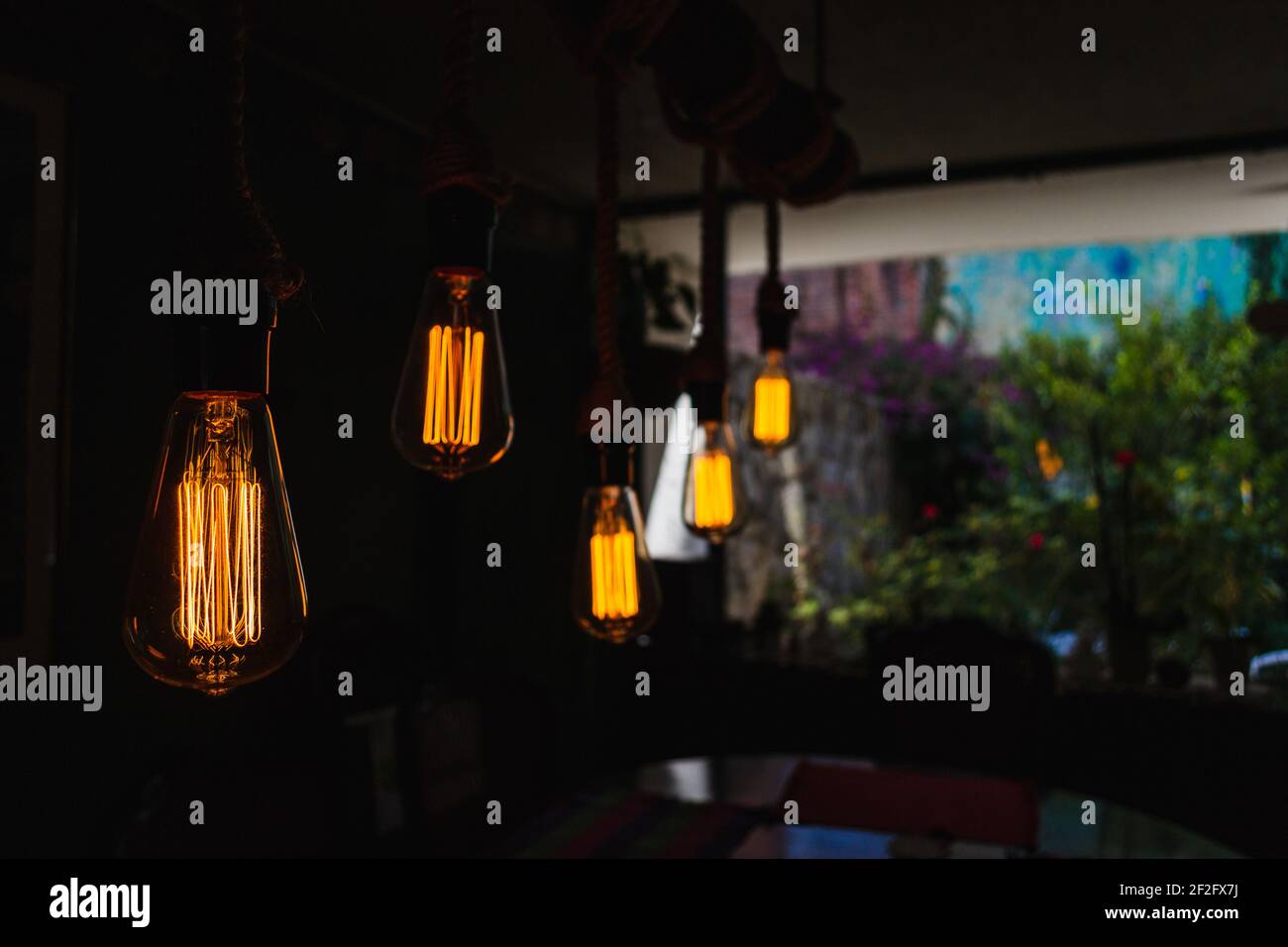 Decorative hanging lamps illuminating hi-res stock photography and ...