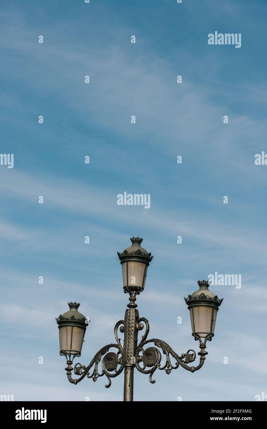 A vertical shot of a beautiful street light on the clear sky background ...