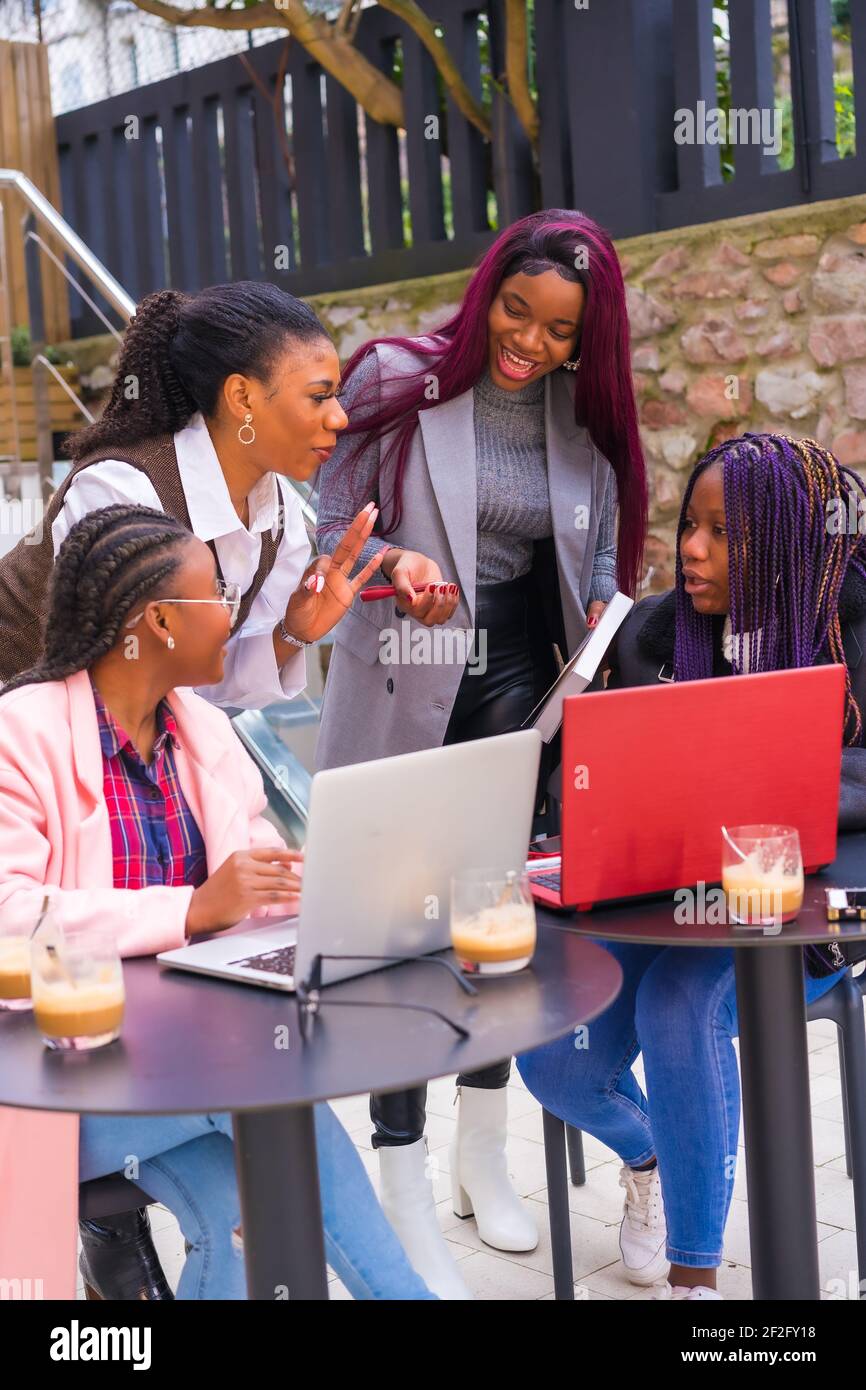 A group of African American businesswomen during a teamwork Stock Photo ...