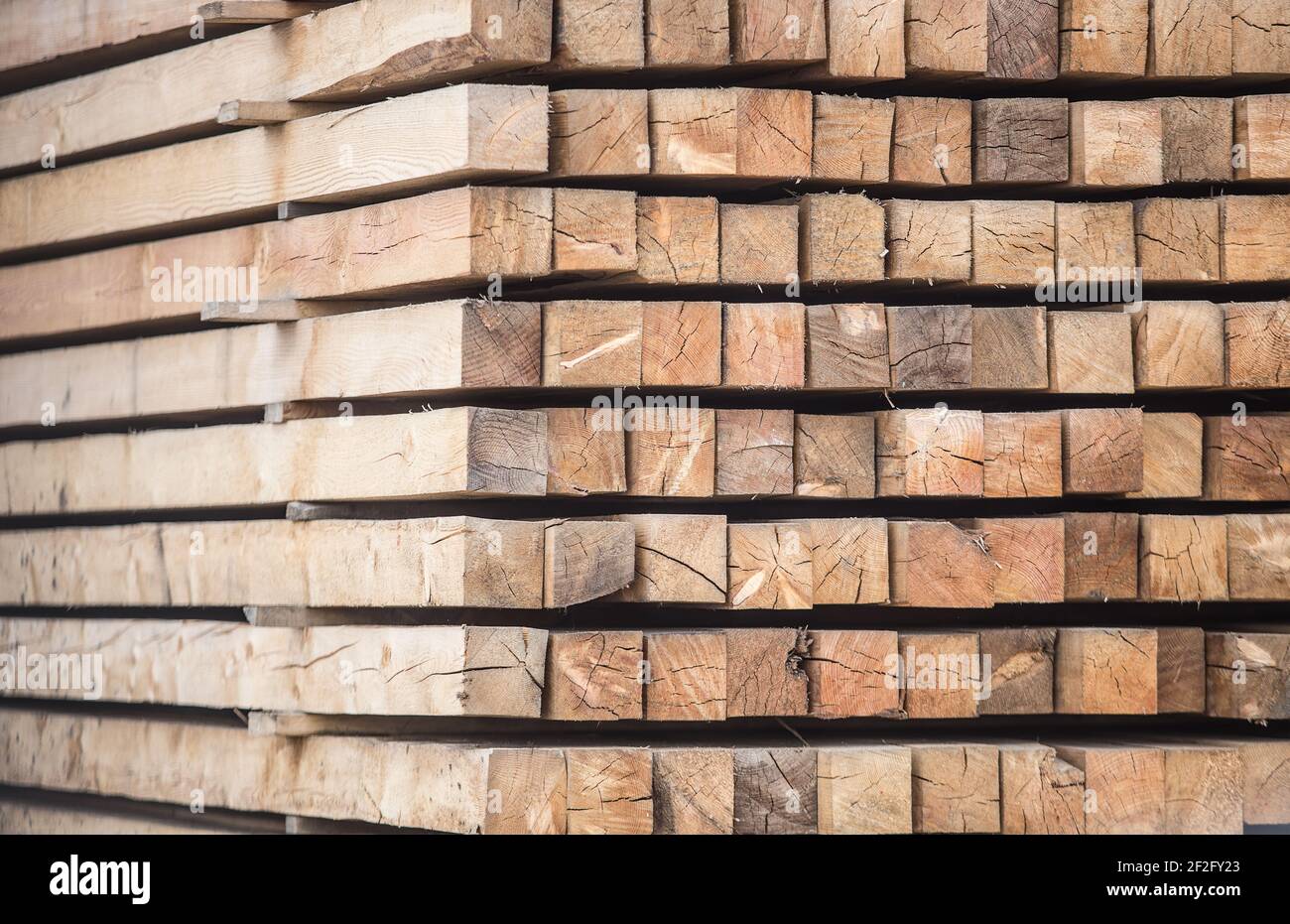 Treated wood in a pile. Closeup. Timber Stock Photo - Alamy