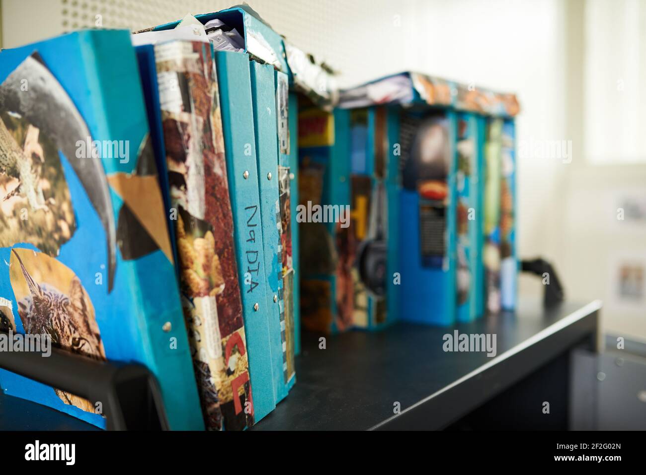 blue binders and books for students at a school Stock Photo - Alamy
