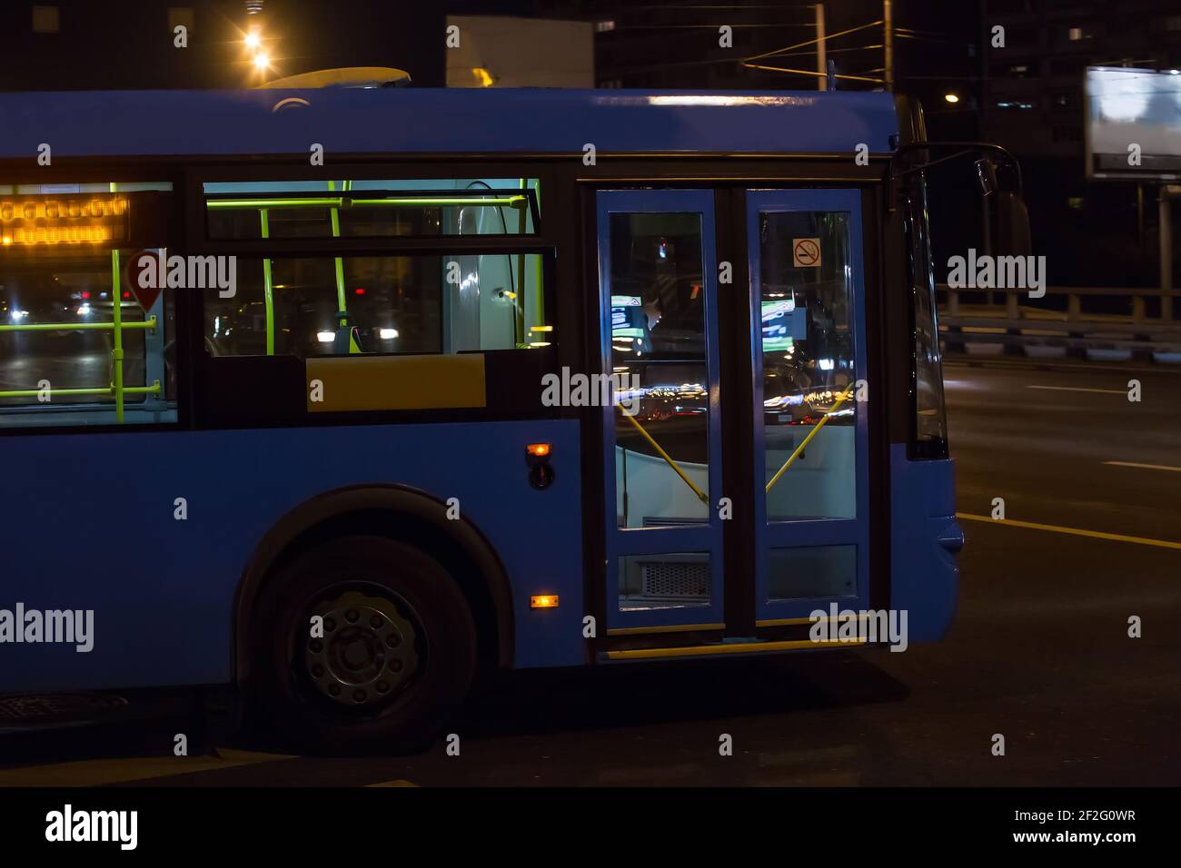 bus moves on city street at night Stock Photo - Alamy