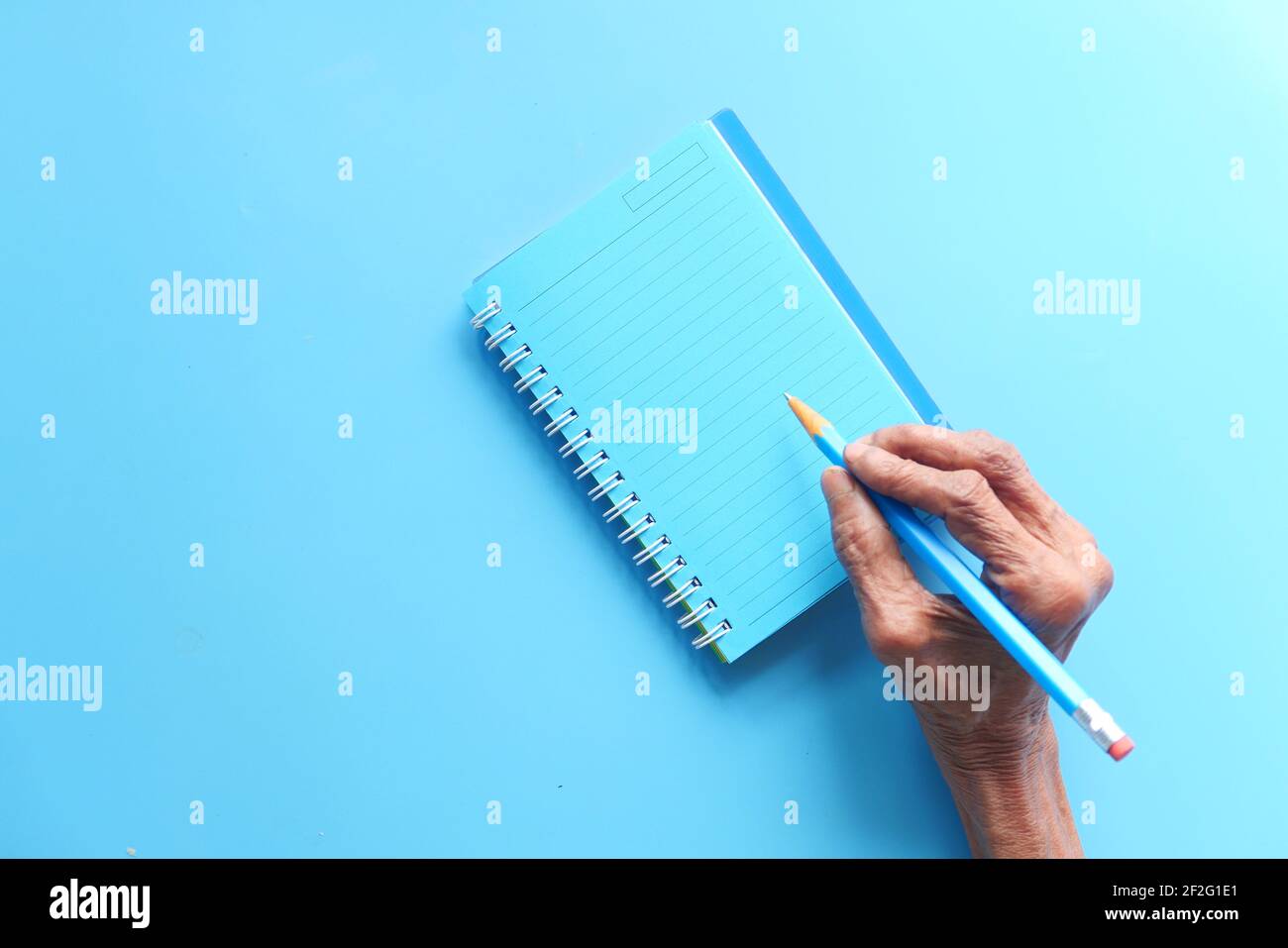 Hand writing learning blue hi-res stock photography and images - Alamy