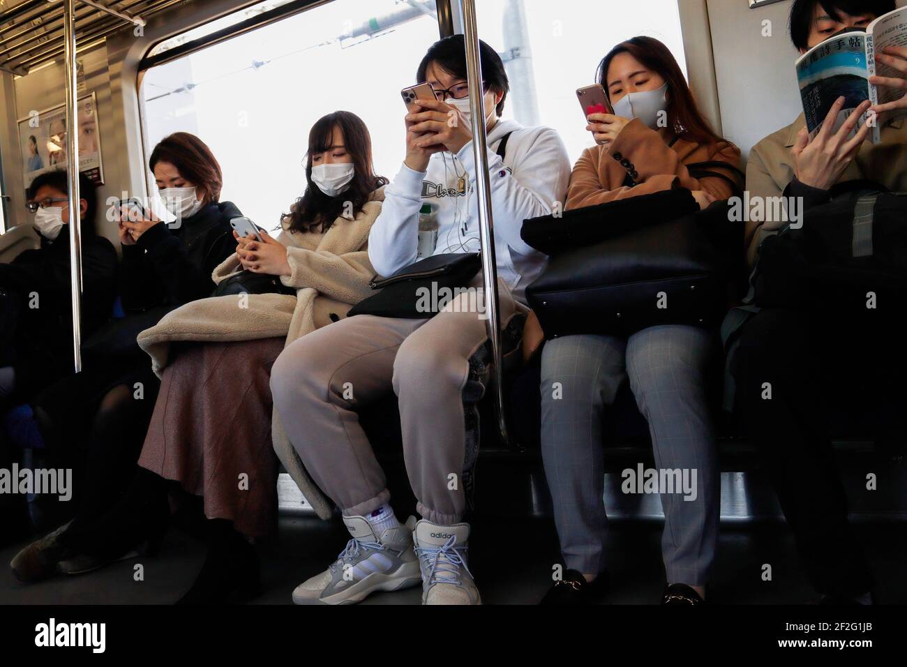 Tokyo, Japan. 10th Mar, 2021. People wearing face masks as a protective ...