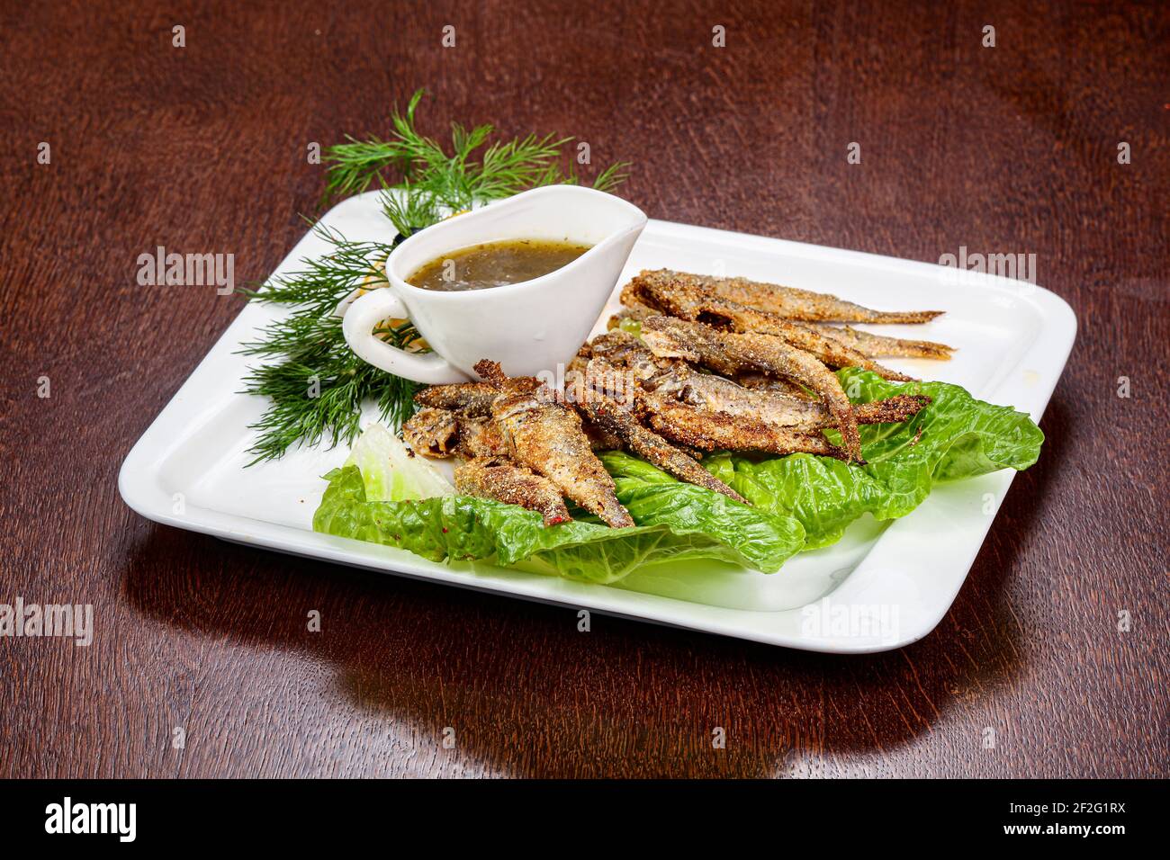 Fried barabulka fish snack with sauce Stock Photo - Alamy