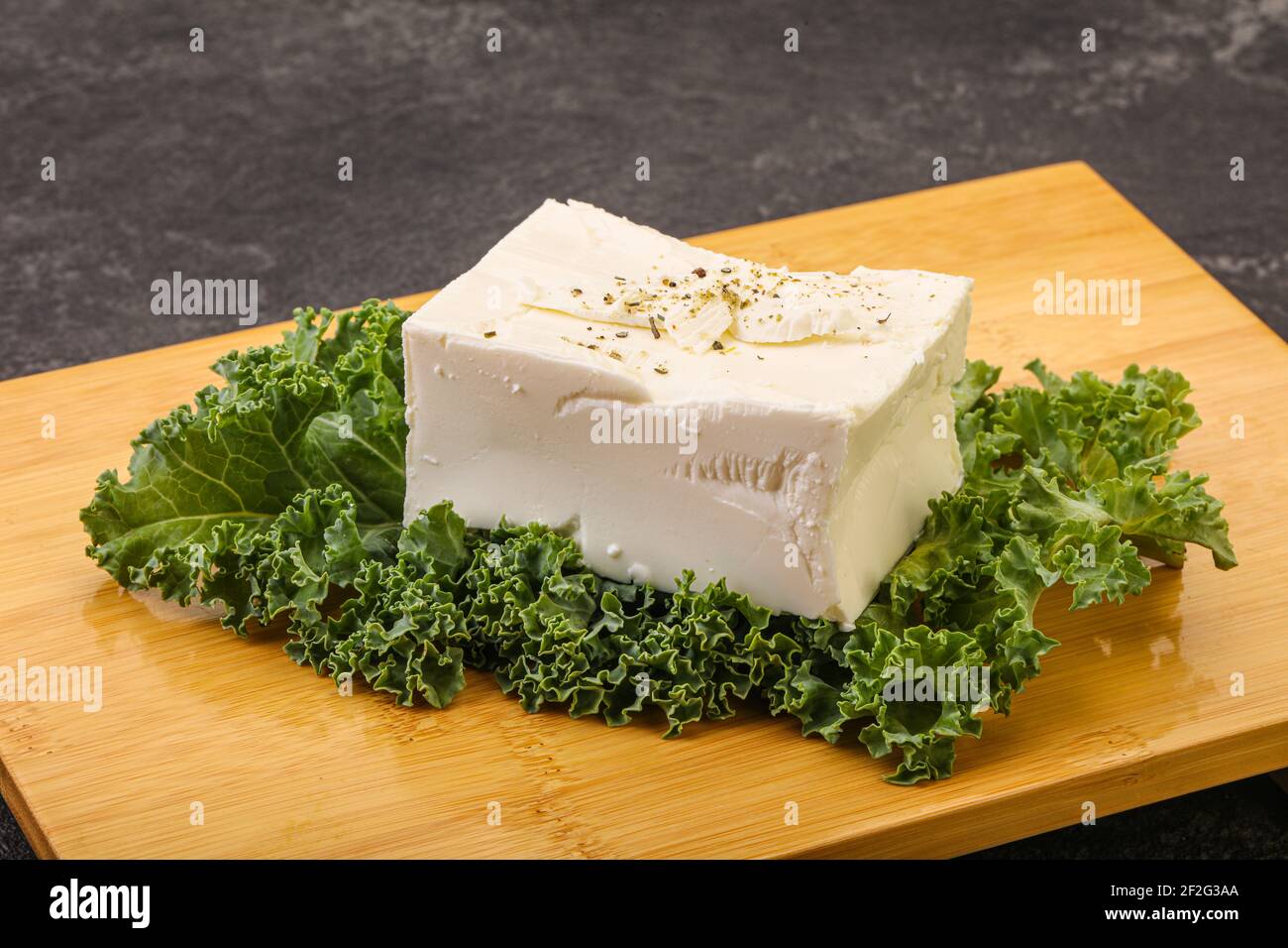 Traditional tasty Greek Feta soft cheese brick Stock Photo - Alamy