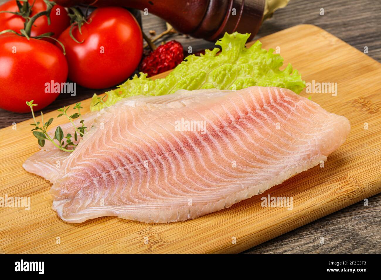 Raw tilapia fish fillet for cooking Stock Photo - Alamy