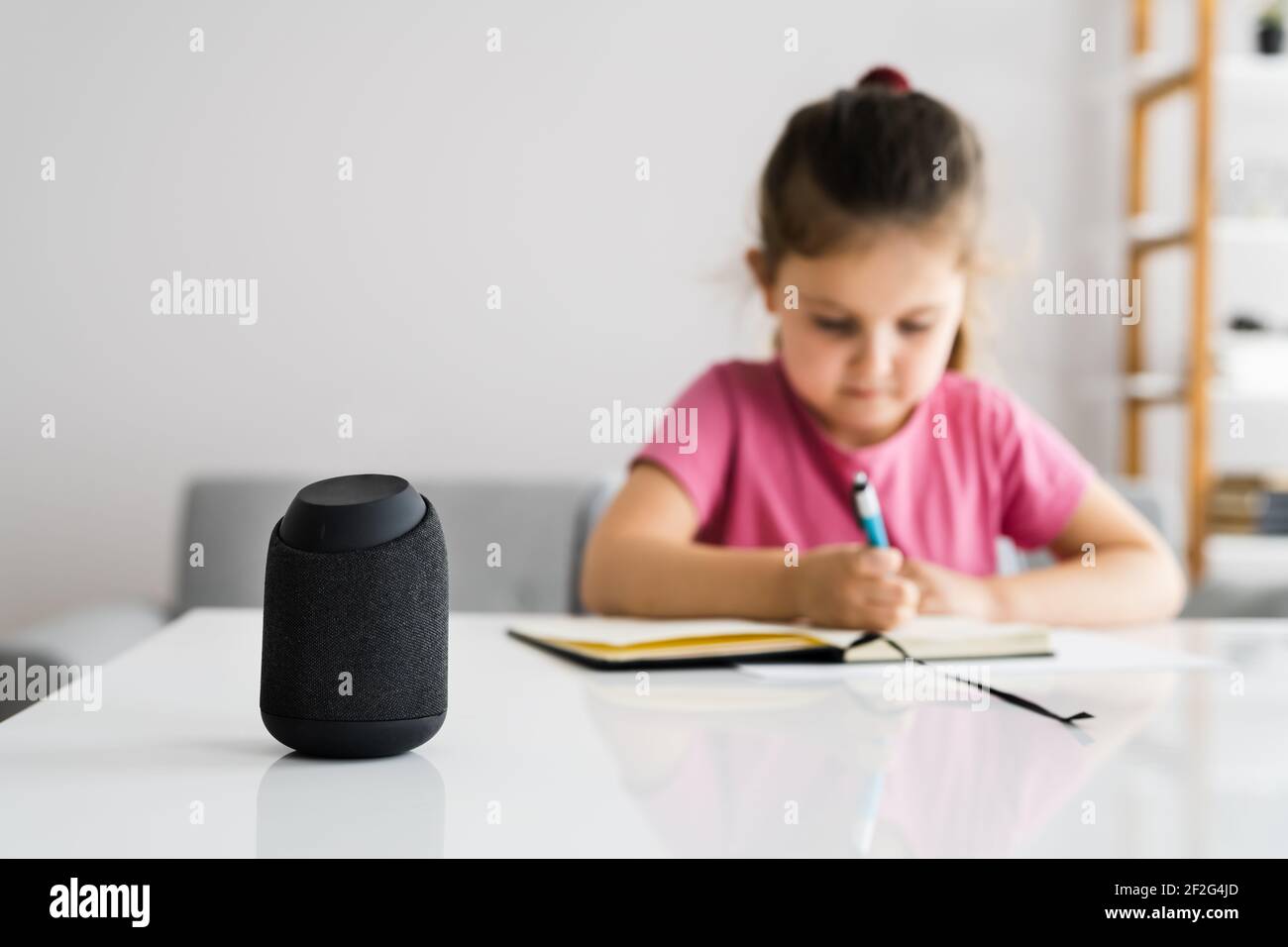 Child Kid Using Smart Speaker And Voice Assistant Stock Photo - Alamy