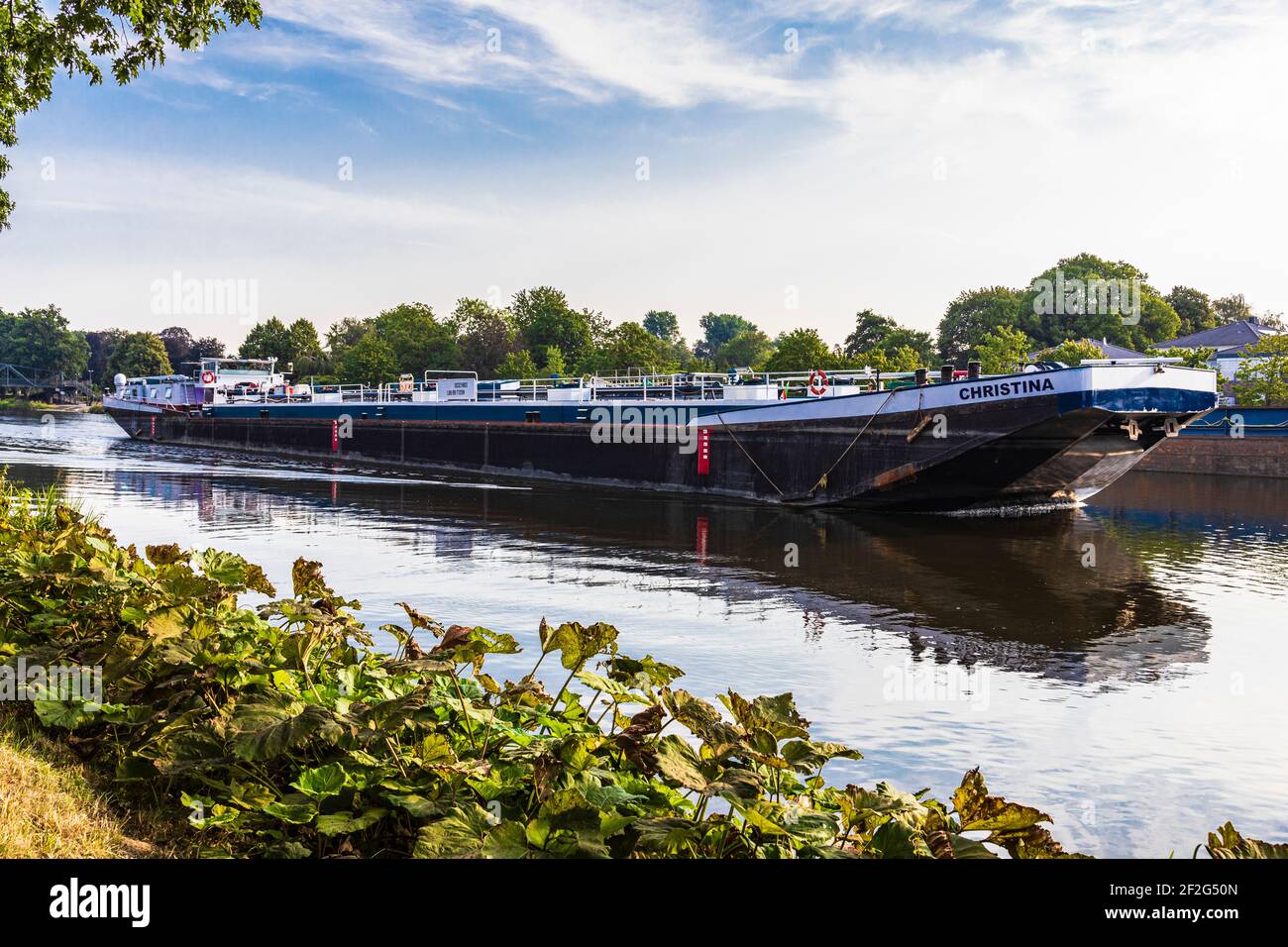 Inland shipping, supply ship Stock Photo - Alamy