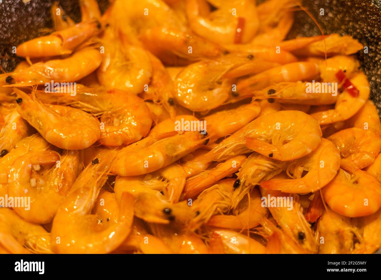 Cooking medium shrimp at home in a skillet Stock Photo - Alamy
